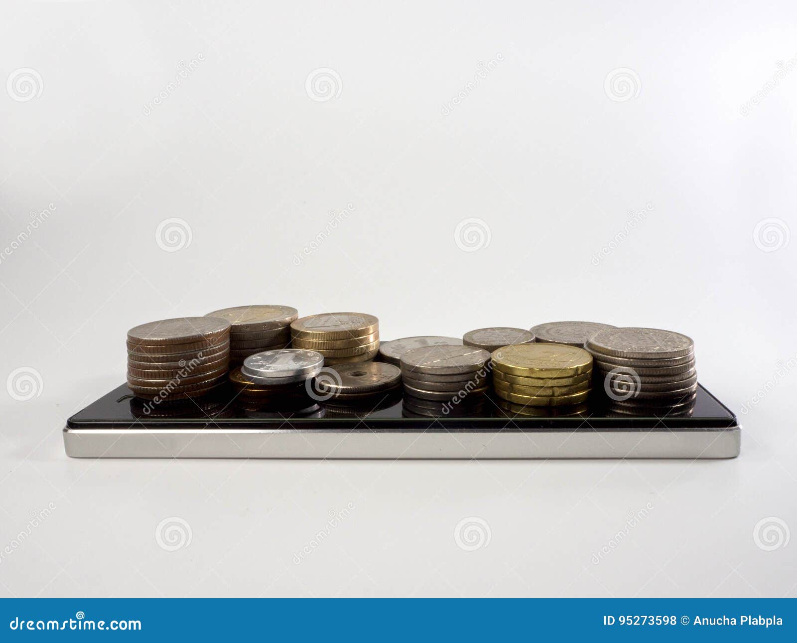 Various Types of Coins on a Cell Phone. Stock Photo - Image of ...