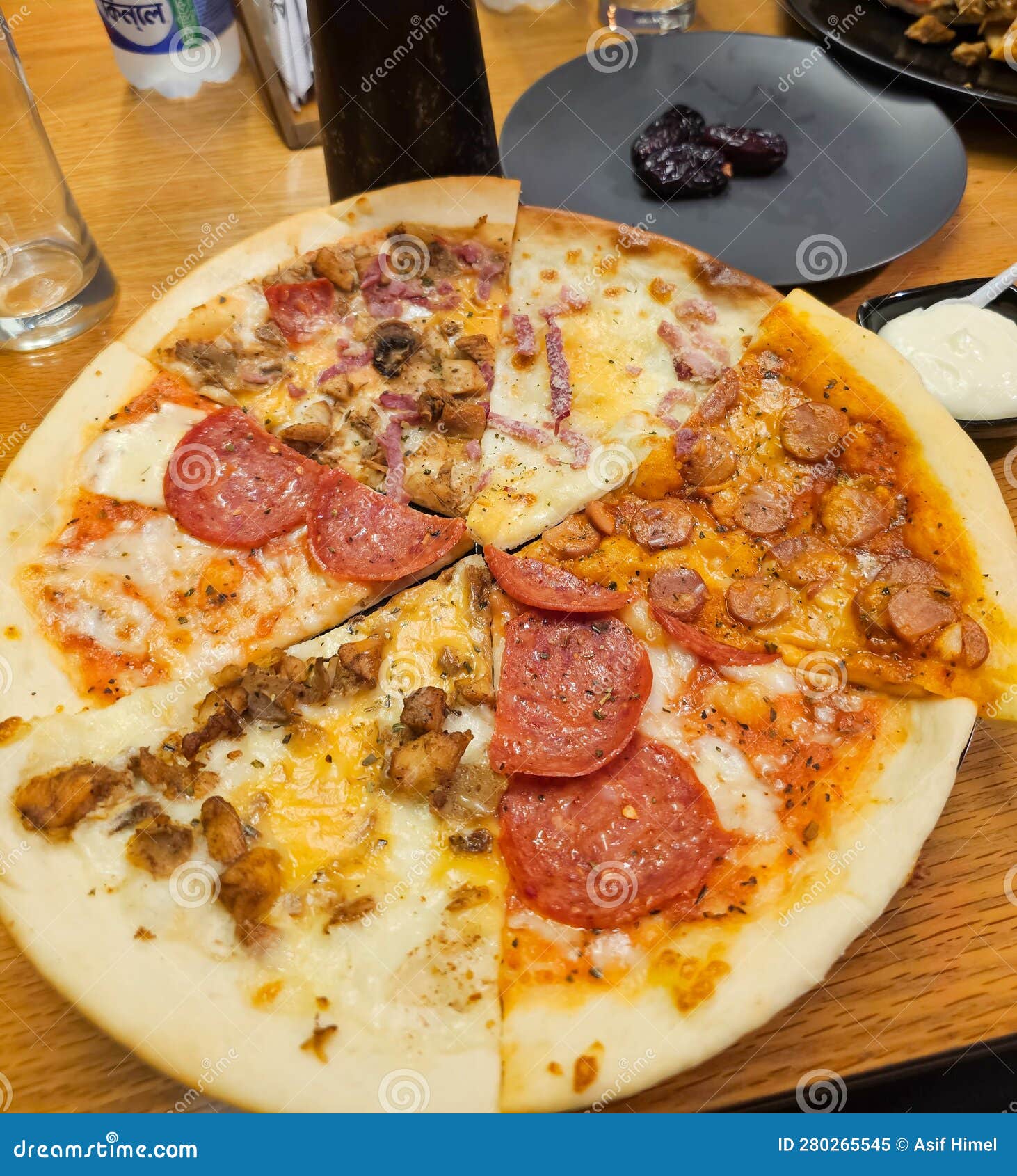 Various Types Of Pizza With Different Types Of Toppings Served On A ...