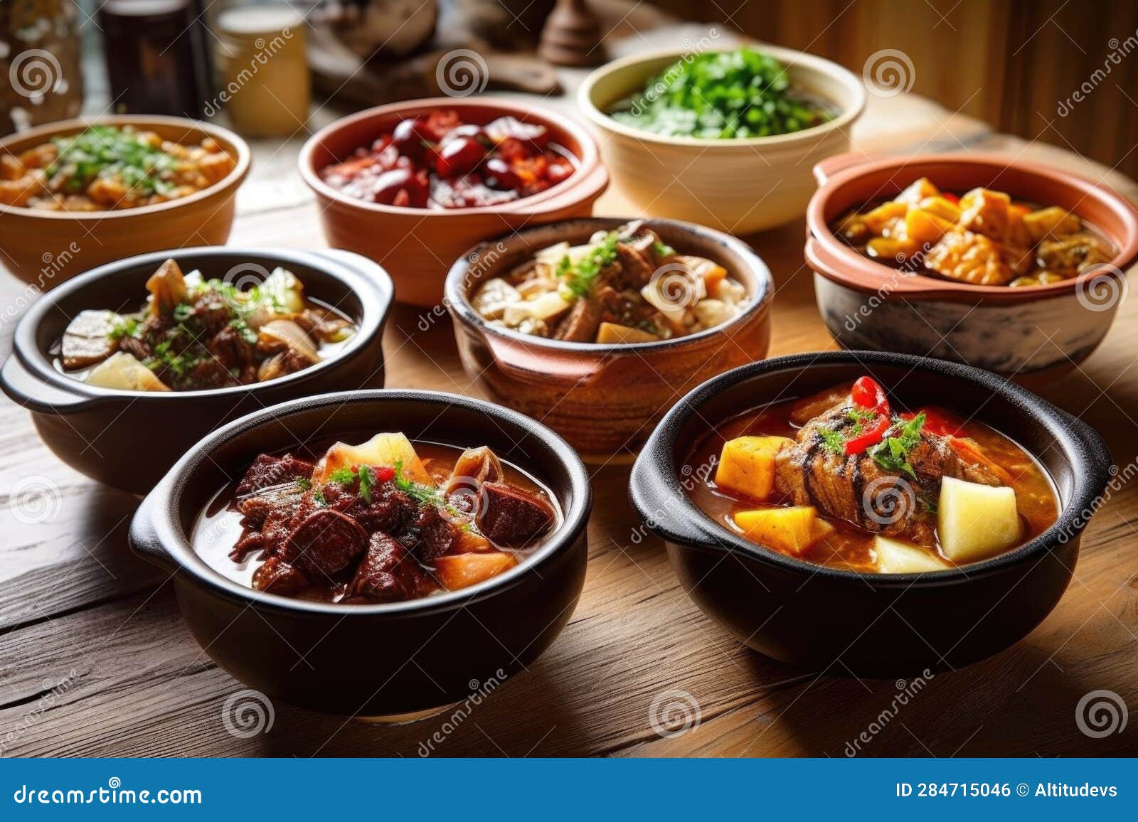Various Types of Stews Displayed in a Row of Bowls Stock Photo - Image ...