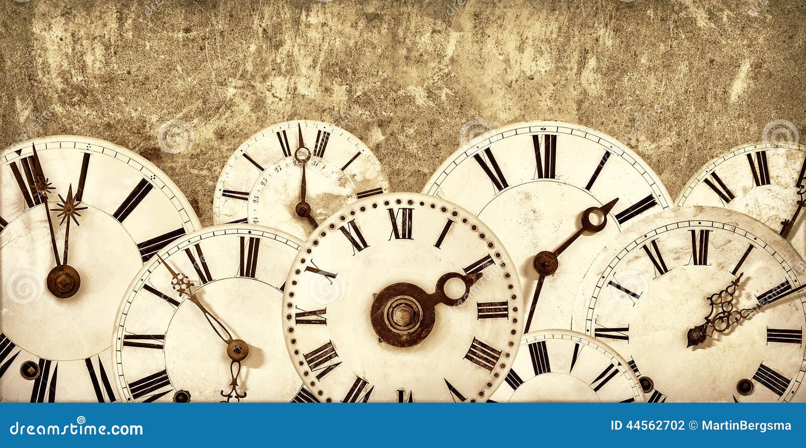 Various Vintage Clock Faces in Front of an Old Wall Stock Photo - Image ...