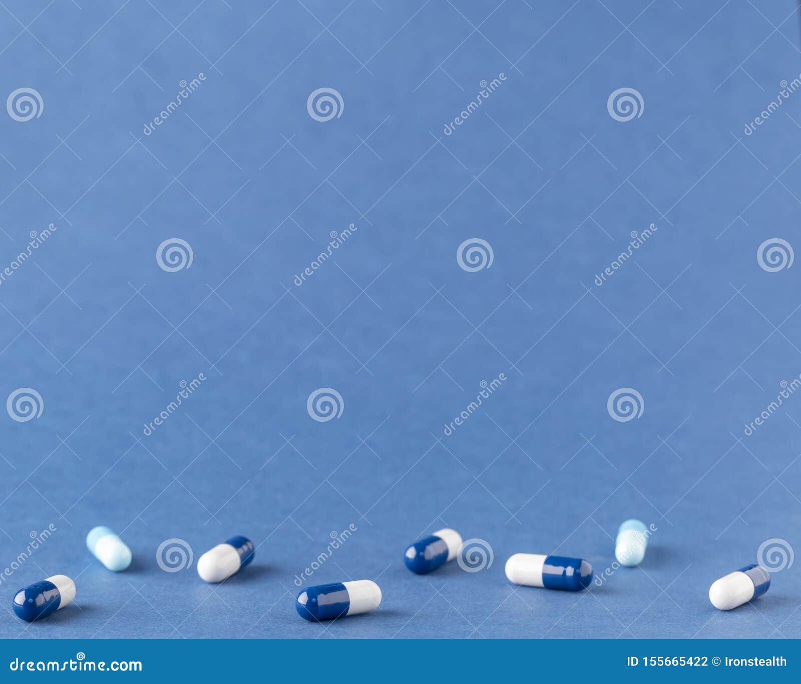Various White-blue Medication Capsules. Blue Background with Text Space ...
