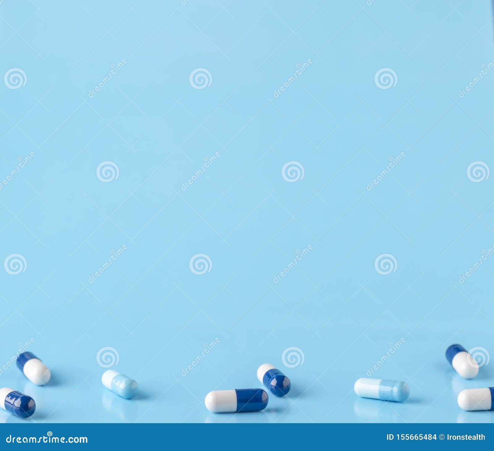 Various White-blue Medication Capsules. Blue Background with Text Space ...