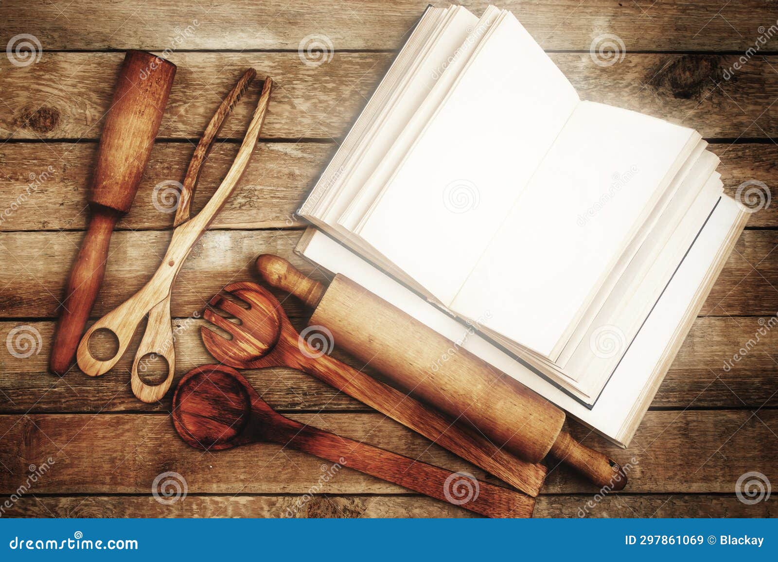 Various Wooden Kitchen Utensils and Vintage Cookbook on the Table Stock ...