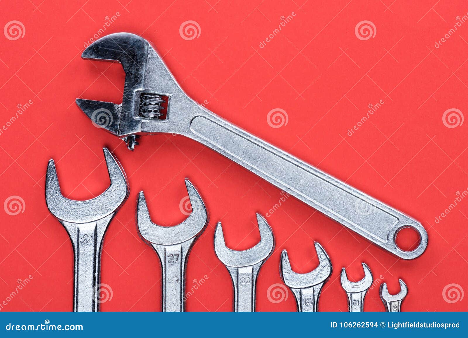 Various wrenches on red stock photo. Image of construction - 106262594