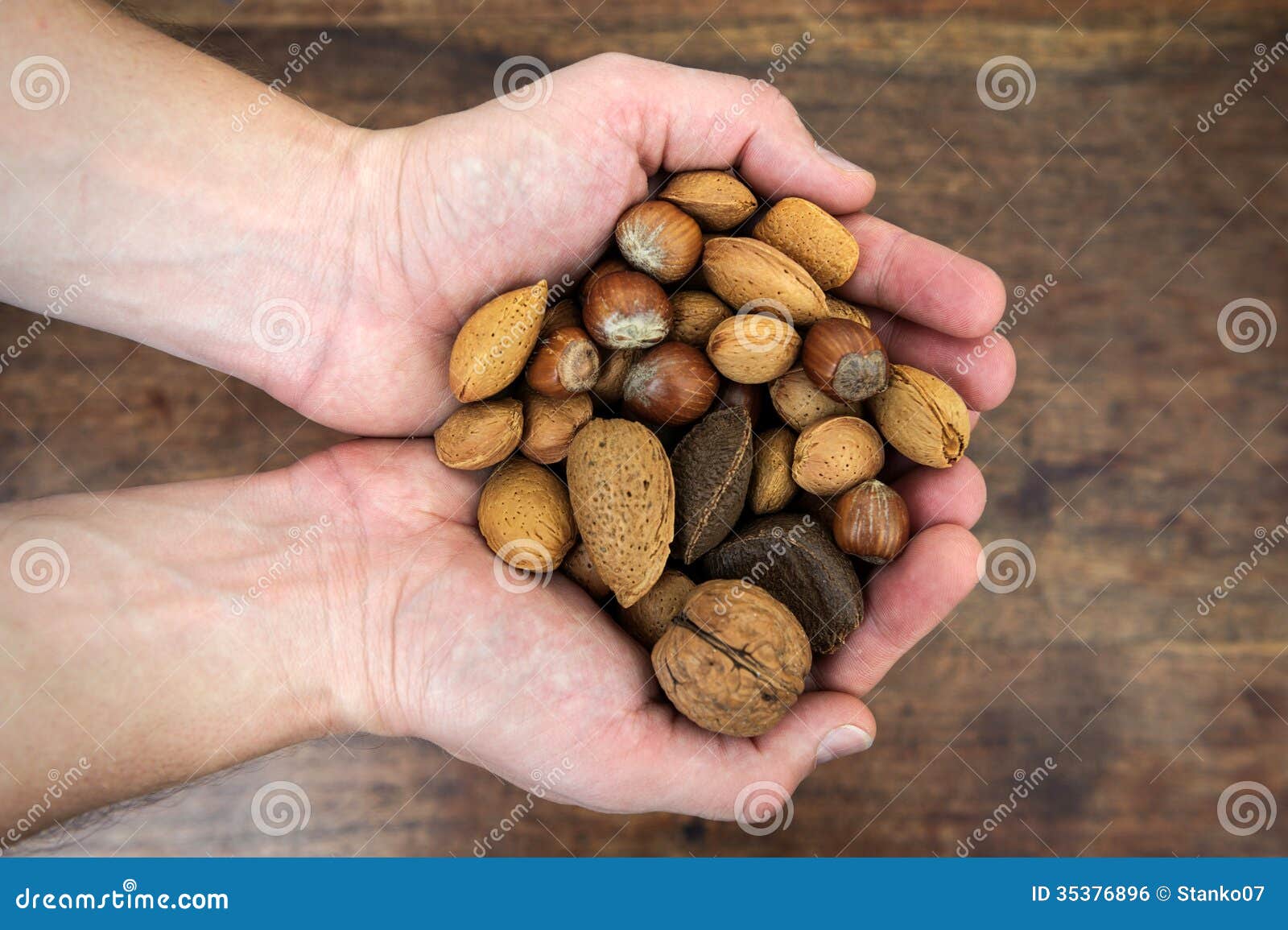 Variuos nuts in hands stock photo. Image of hand, almonds - 35376896