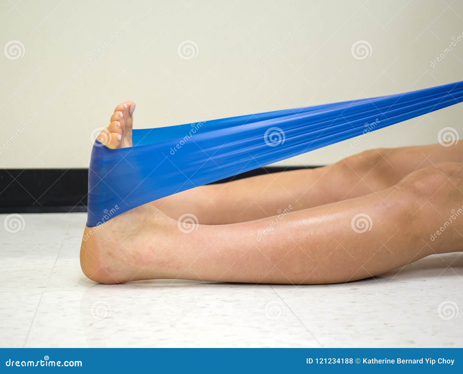 Varsity Athlete Using a Theraband Exercise Band To Strengthen Her Ankle ... Varsity Athlete Using a Theraband Exercise Band To Strengthen Her Ankle ...