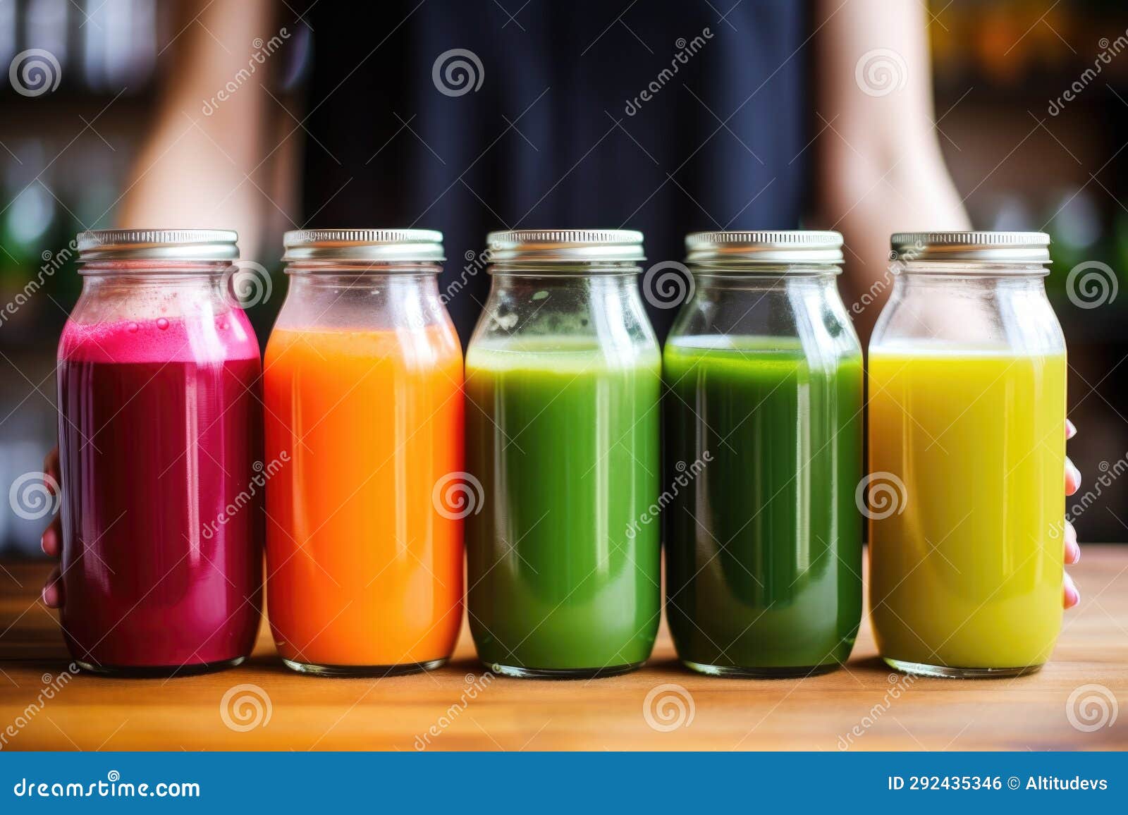 A Vary of Cold Pressed Juices in Vibrant Colors, Hand Selecting One ...