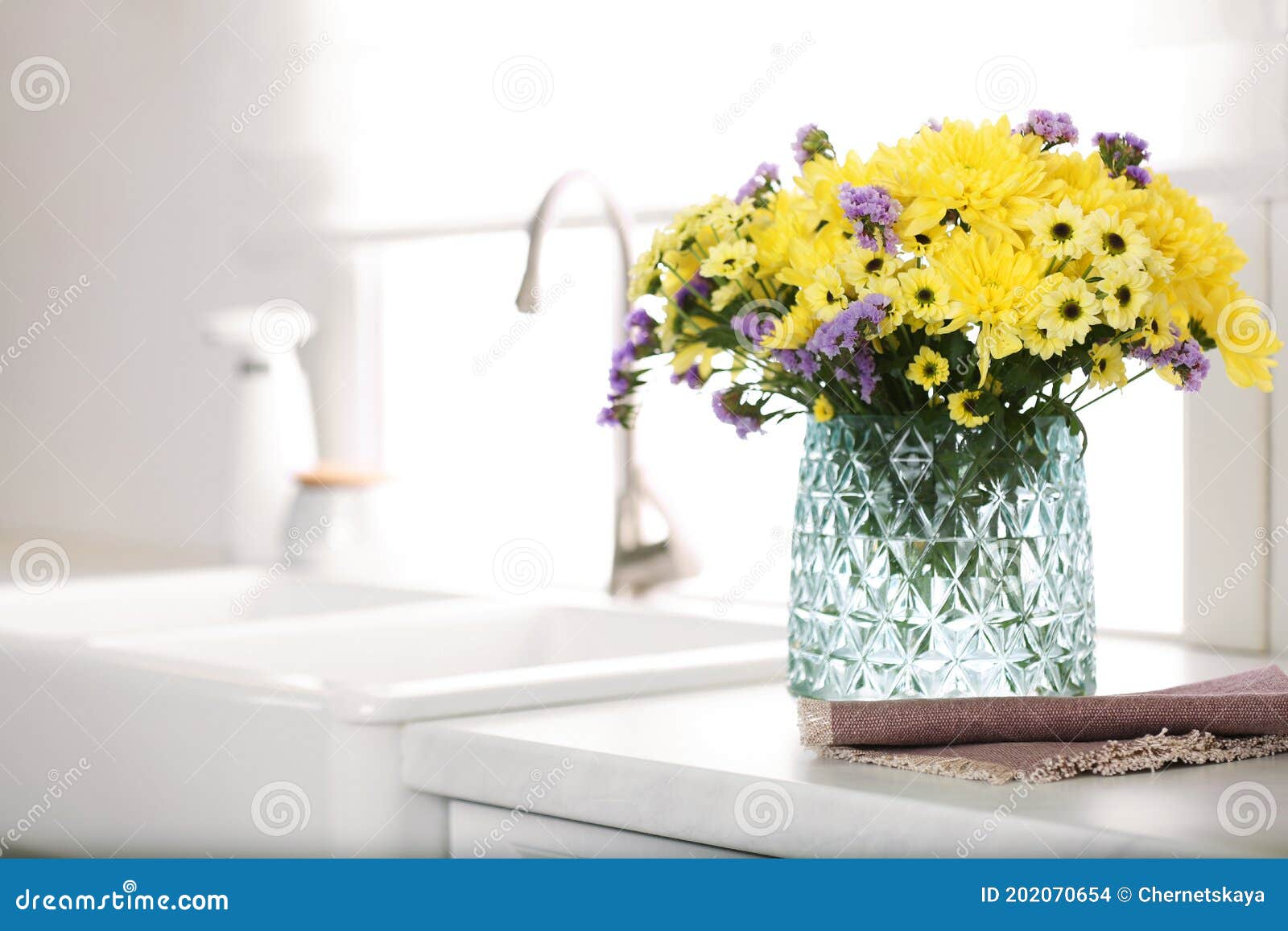 Vase with Beautiful Chrysanthemum Flowers on Countertop in Kitchen ...