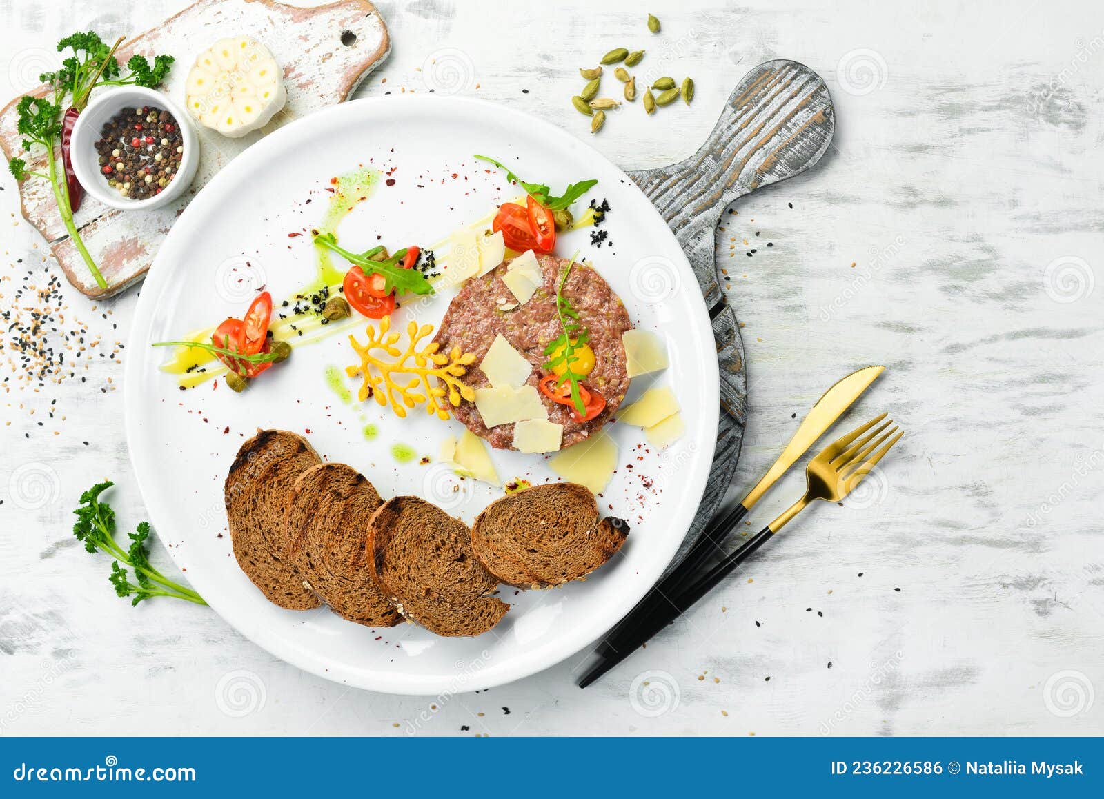 Veal Tar-tar, with Toast Bread and Vegetables on a White Plate. Stock ...