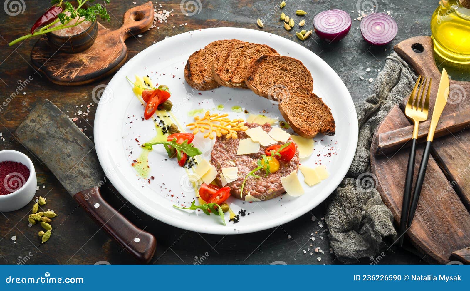 Veal Tar-tar, with Toast Bread and Vegetables on a White Plate. Stock ...
