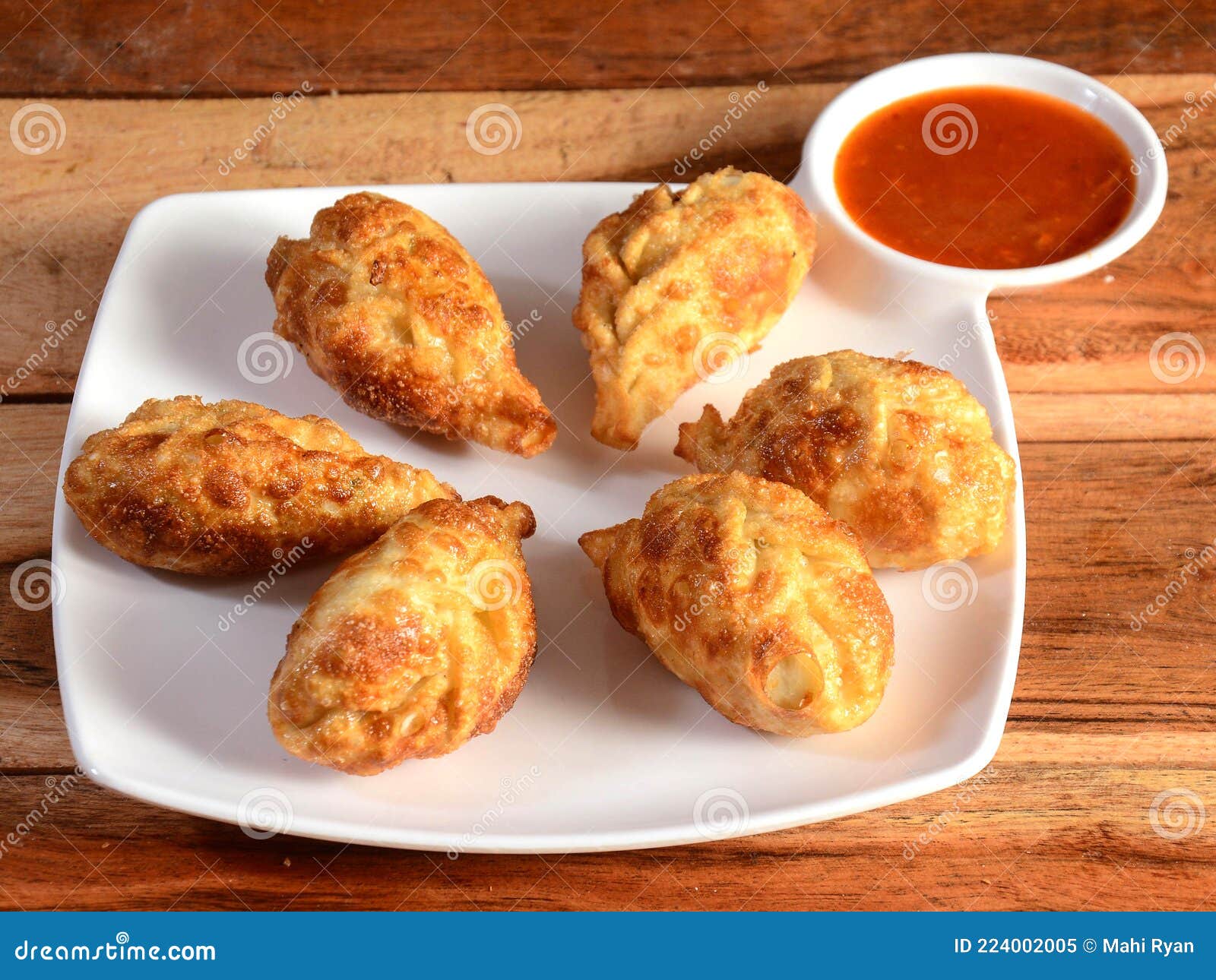 Veg Fried Momo with Sauce Served Over a Rustic Wooden Background ...