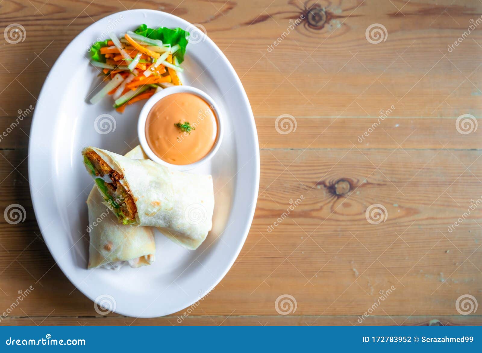 Vegetable Fillings Rolled Inside an Indian Bread Served on a White ...