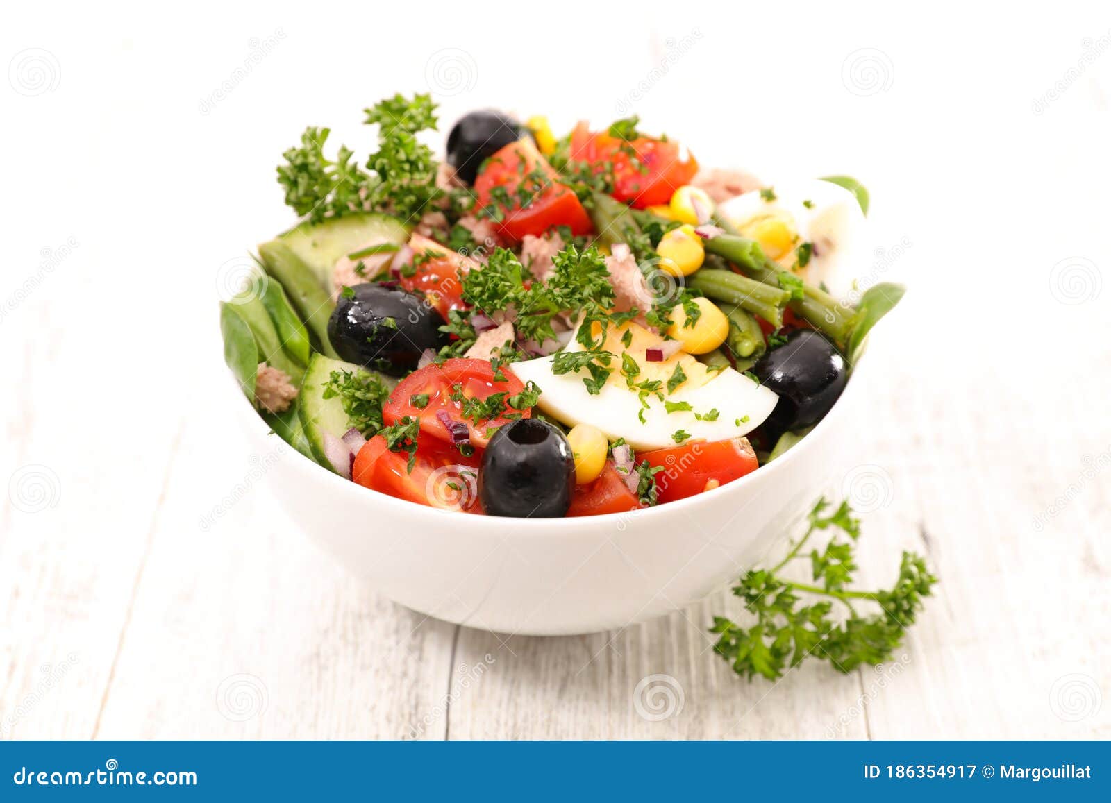 Vegetable salad in bowl stock image. Image of tomato - 186354917