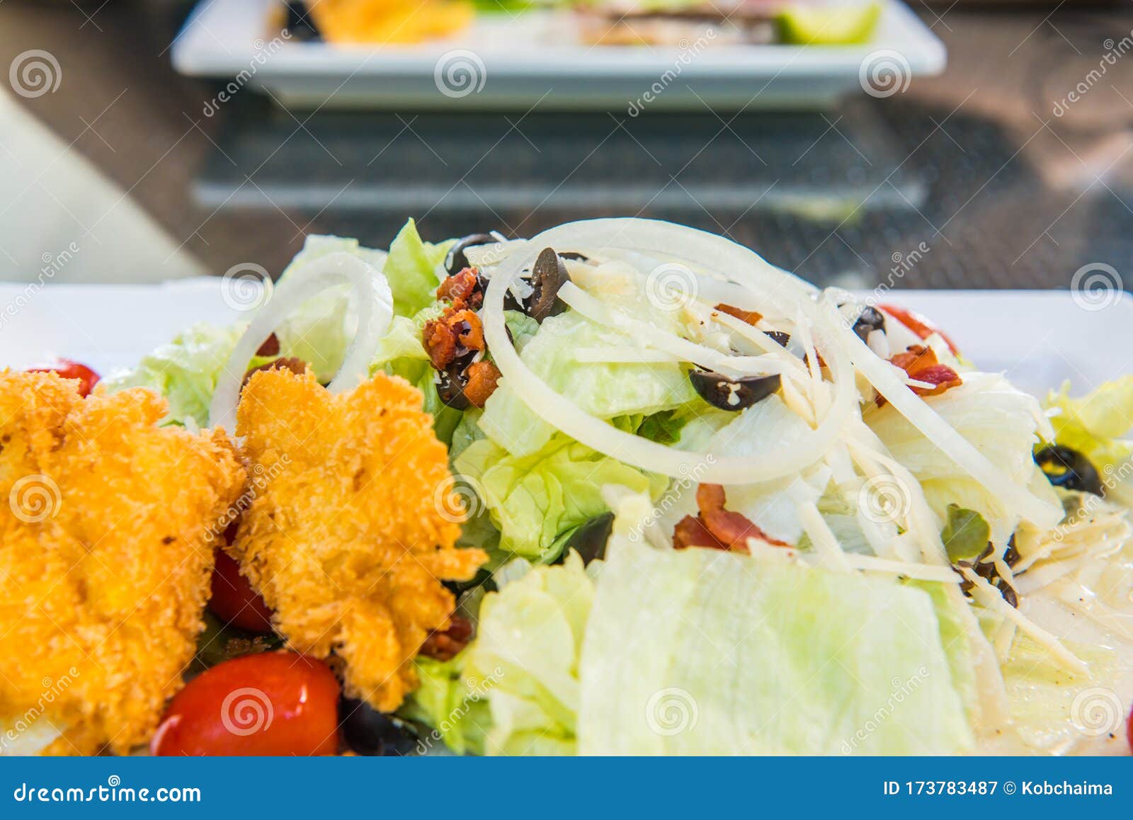 Vegetable Salad with Breaded Fried Fish Stock Image - Image of ...