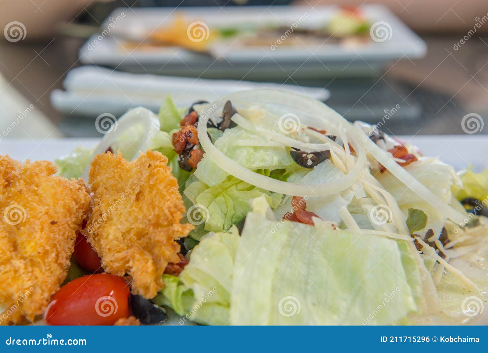 Vegetable Salad with Breaded Fried Fish Stock Photo - Image of ...