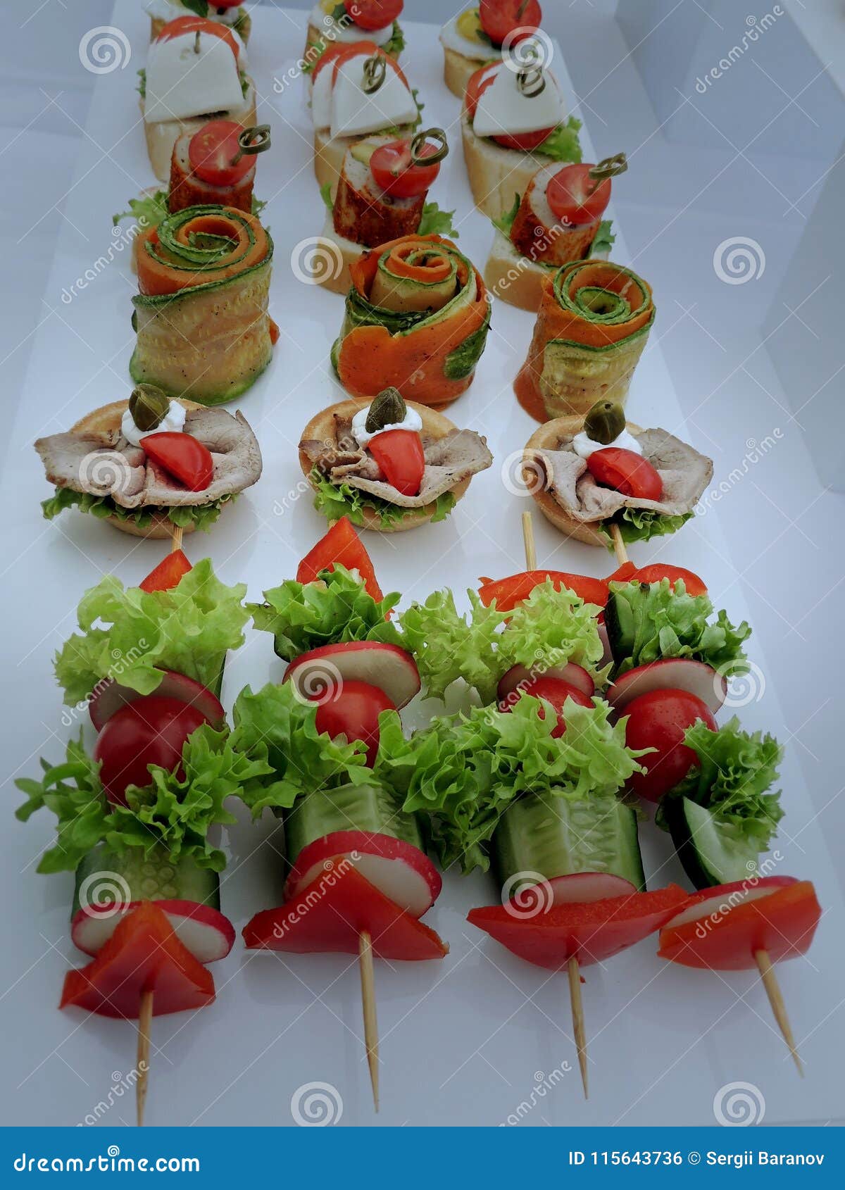 Vegetable Starters on Skewers and Ham Appetizers on White Table Stock ...