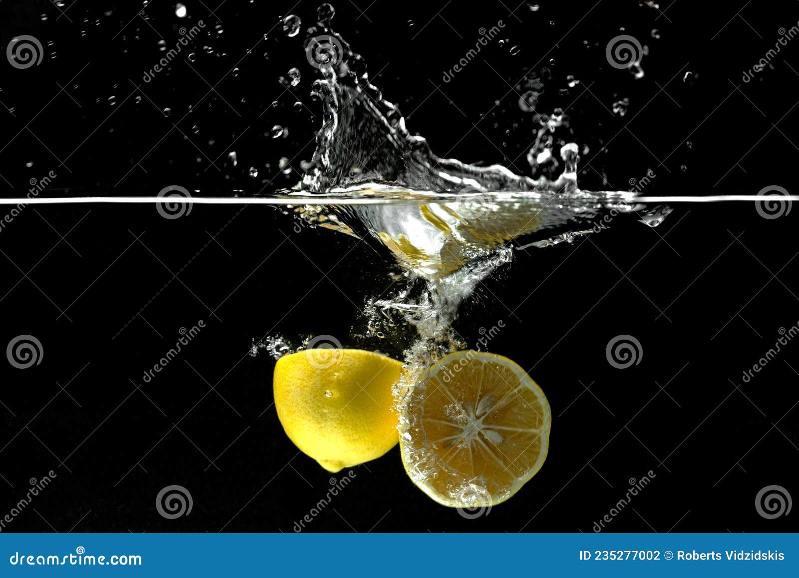 Lemon Falling into Water Creating Movement, Motion and Splashes Stock ...