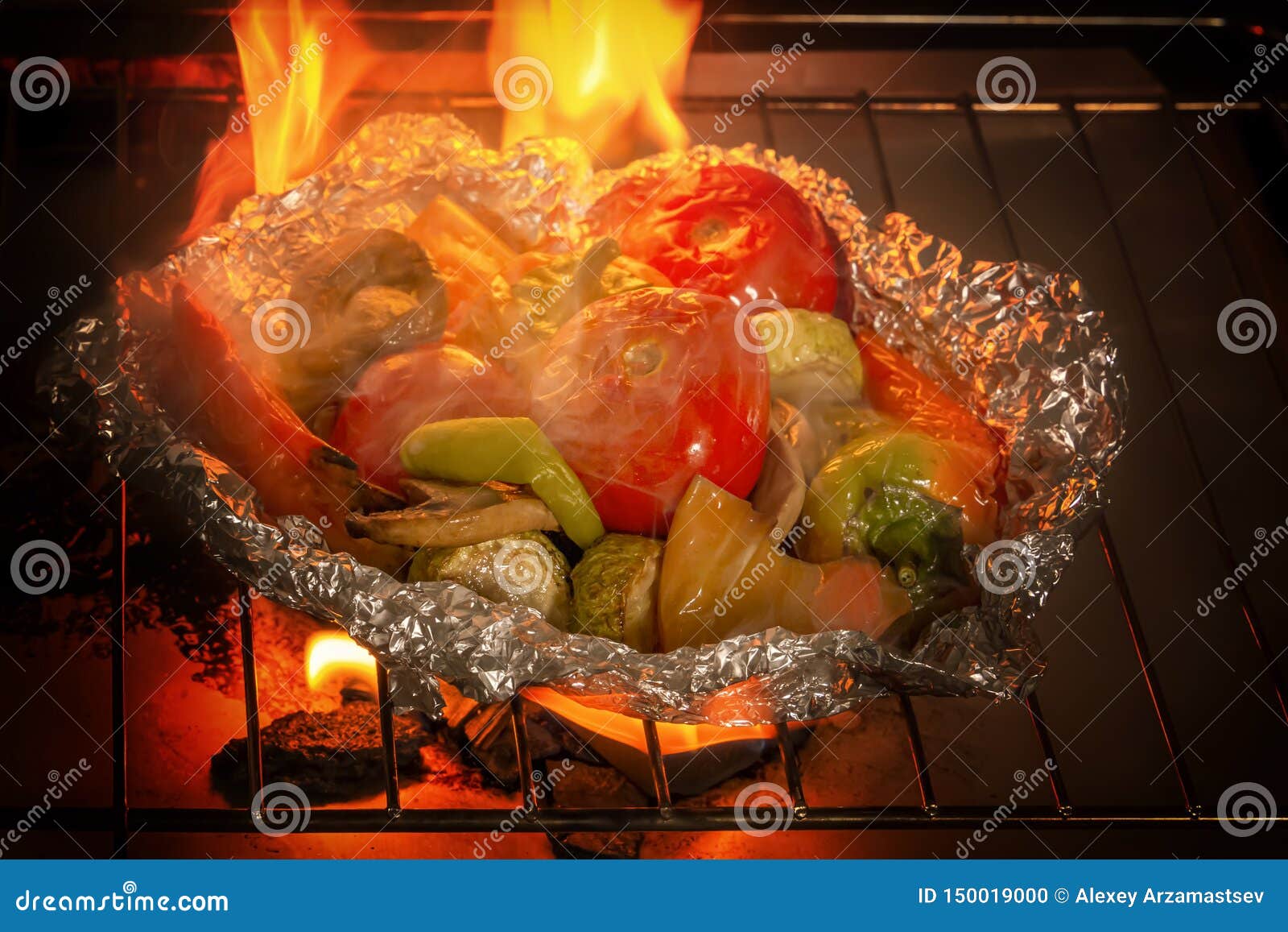 Vegetables in Foil are Baked on Fire. Close-up Stock Photo - Image of ...