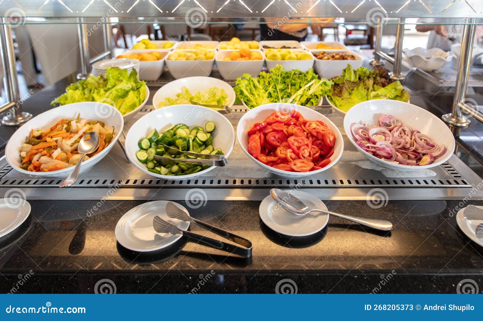 Vegetables with Greens in Plates on Display in the Dining Room. Stock ...
