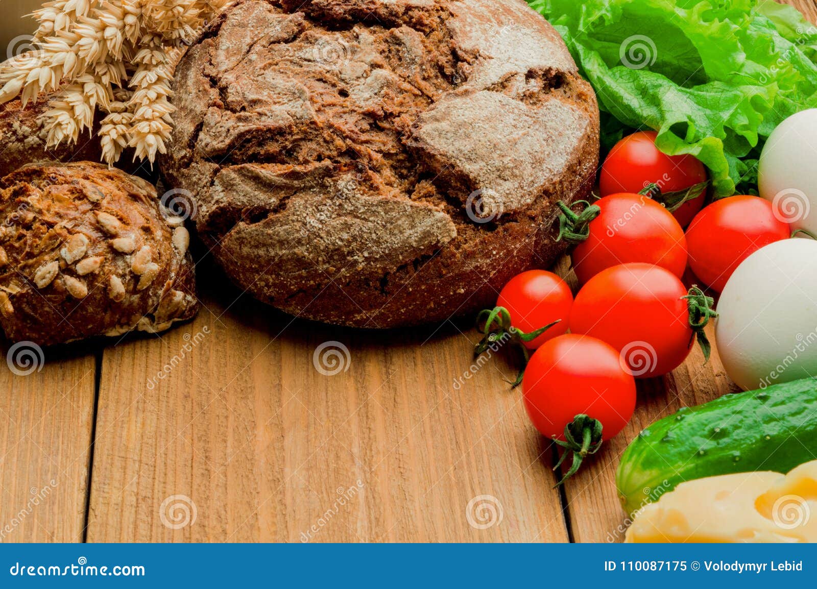 Mixed Vegetables and Two Breads on Kitchen Table Stock Image - Image of ...