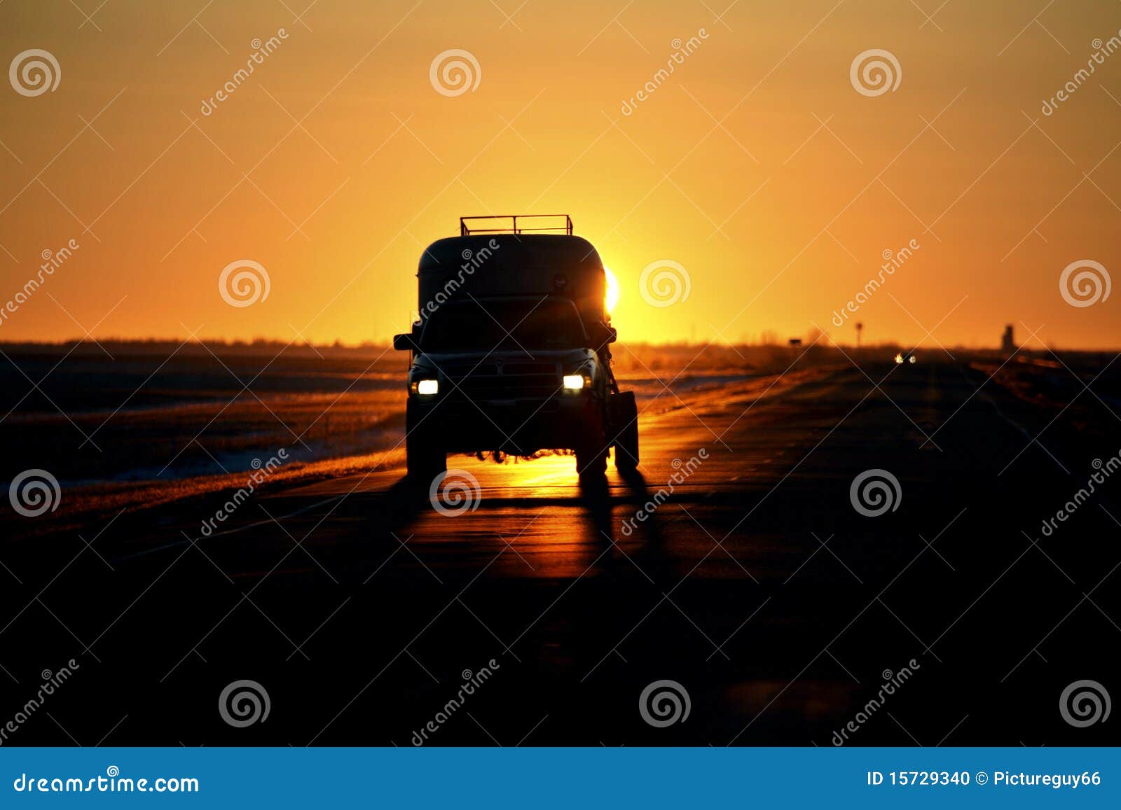 Vehicle Backlit by Rising Sun Stock Photo - Image of landscape, color ...