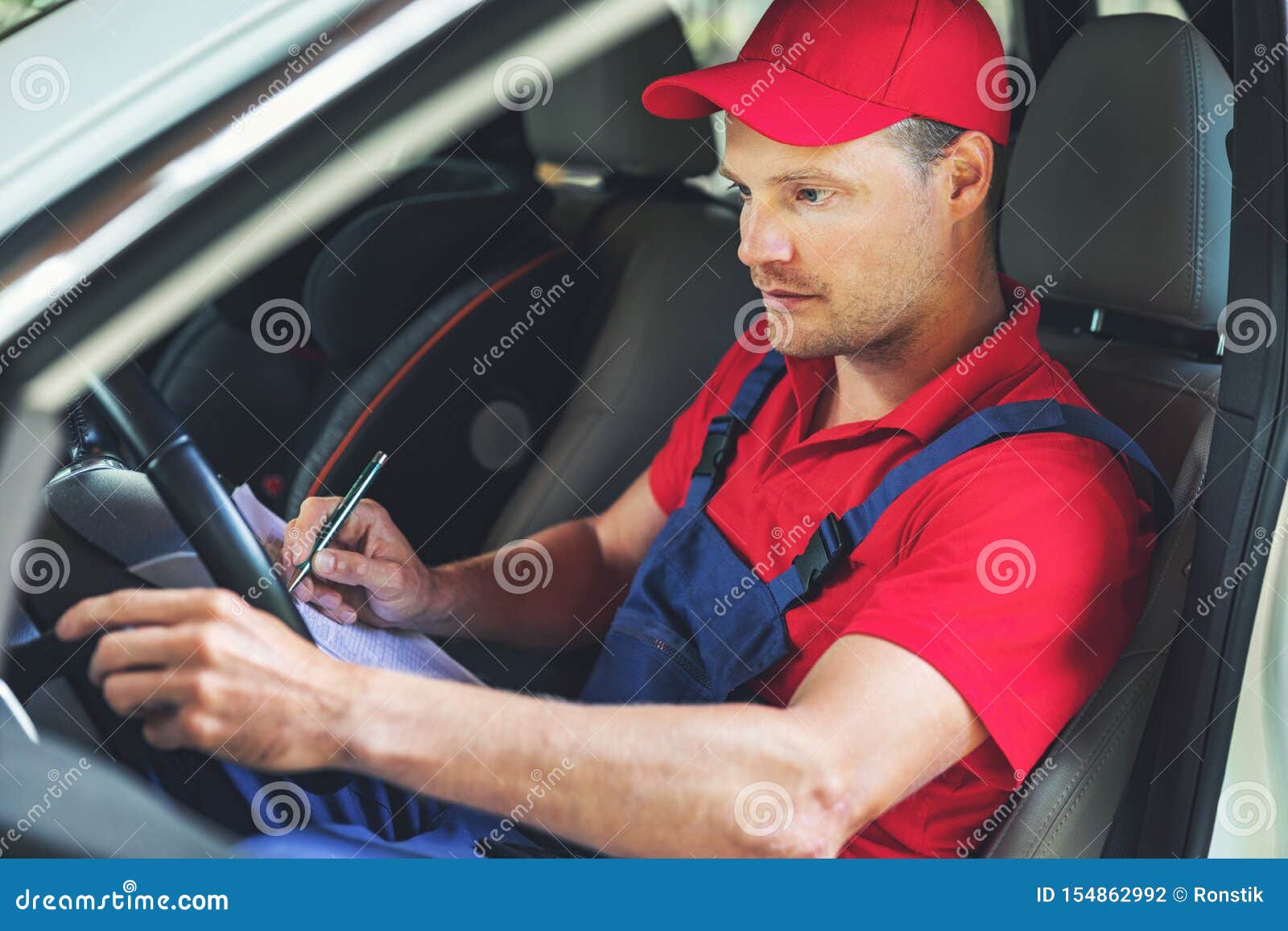 Vehicle Technical Inspection - Mechanic Sitting Inside the Car and ...