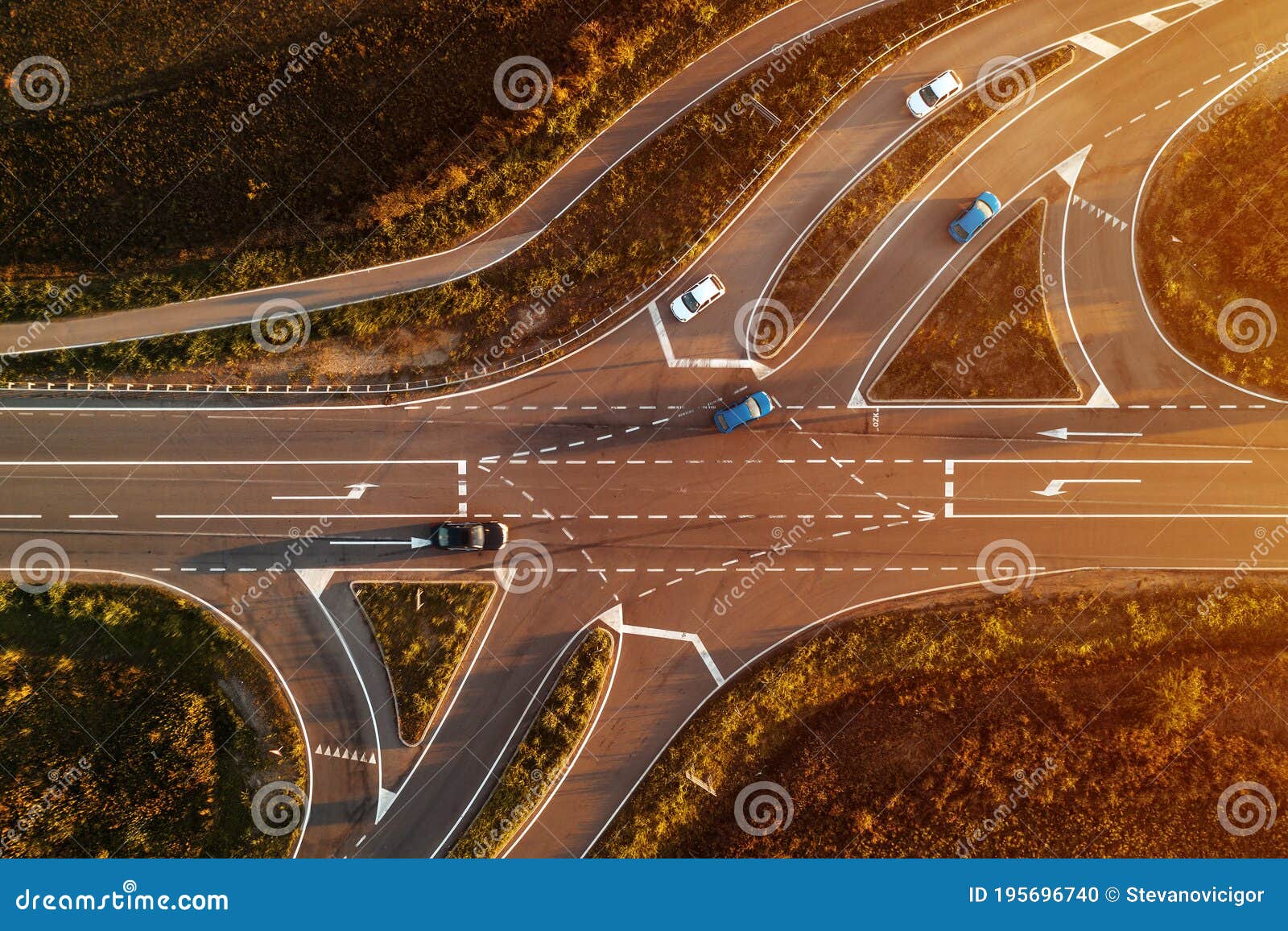 Vehicles on the Road Intersection through Countryside Landscape Stock ...
