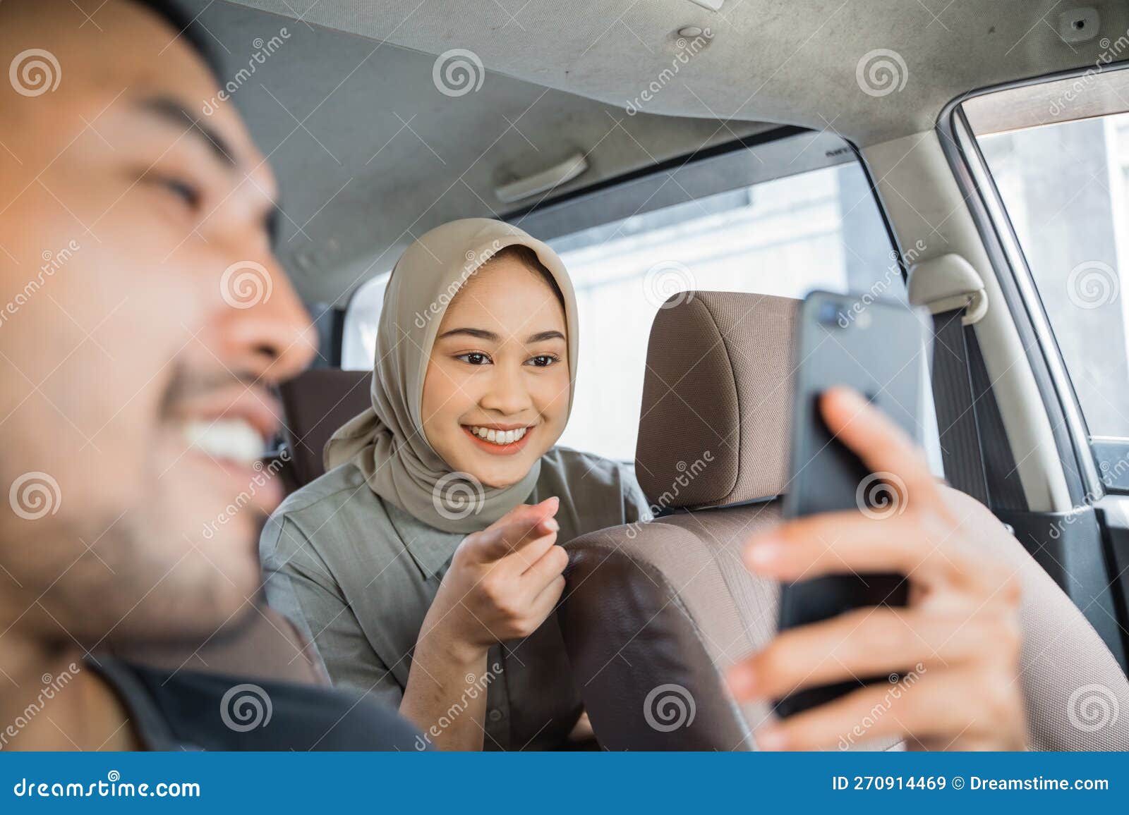 Veiled Female Passenger Asks Driver about Destination on Phone App ...