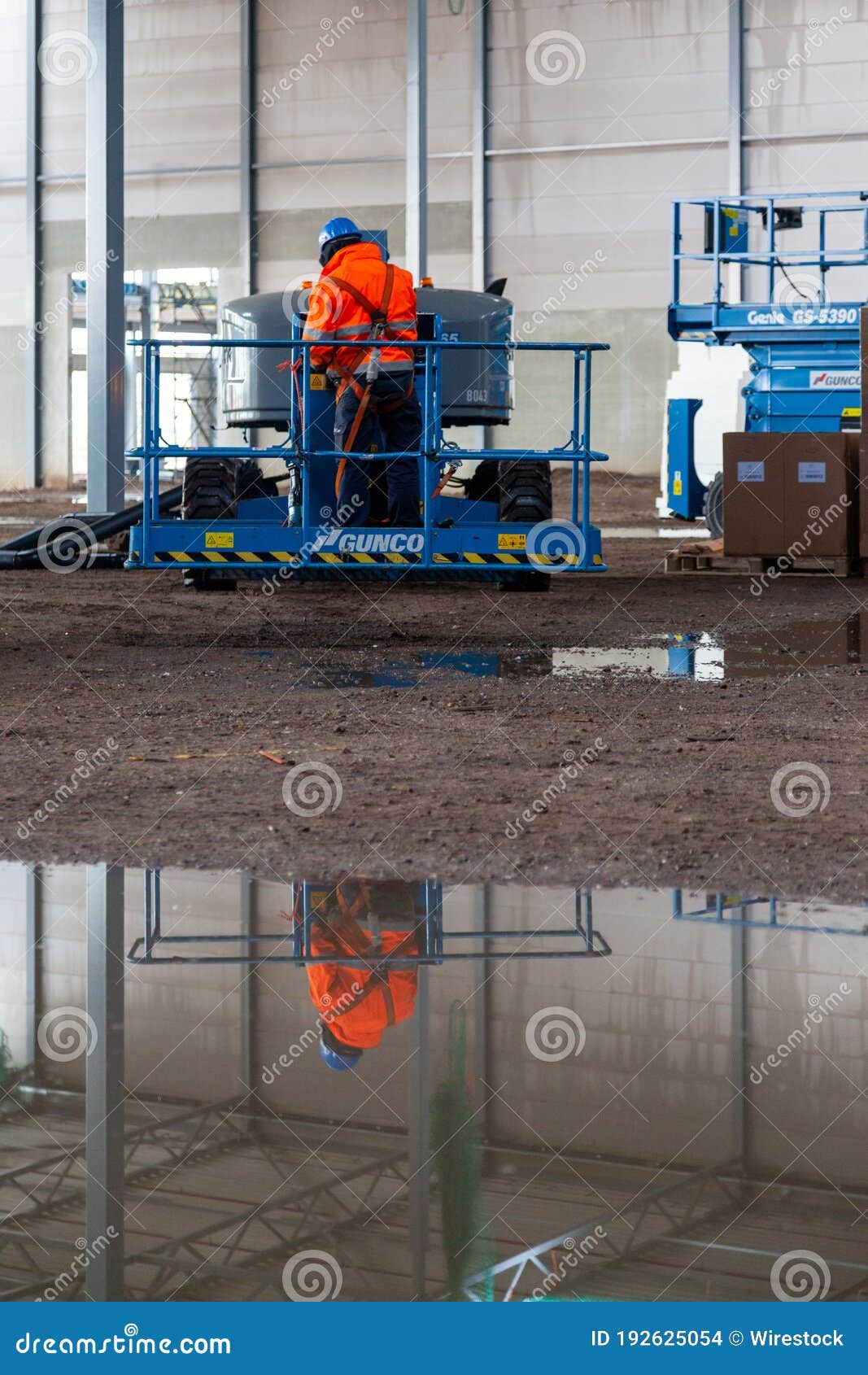 Man Riding with a Lifting Platform Inside a Warehouse Editorial Stock ...
