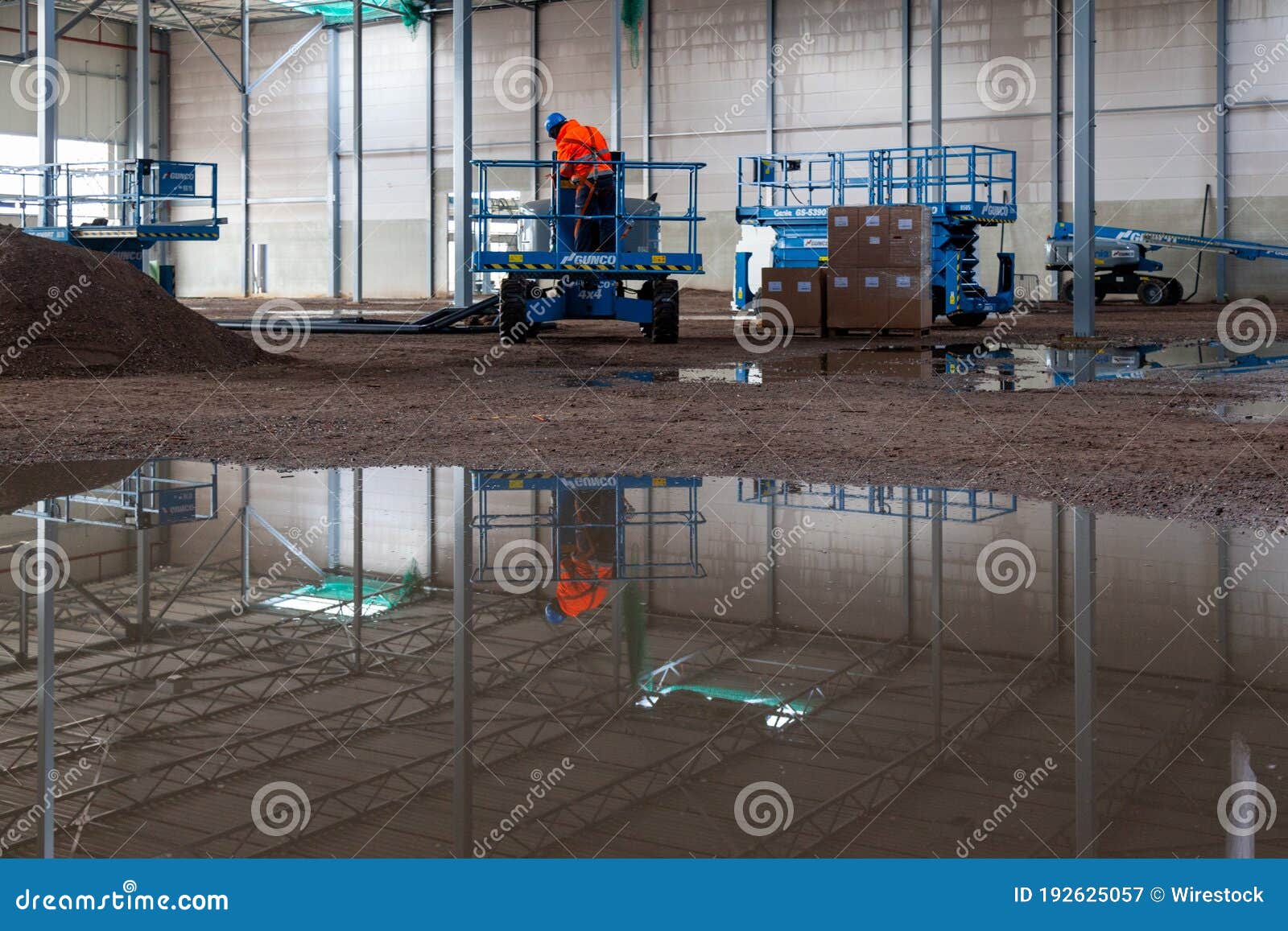 Man Riding with a Lifting Platform Inside a Warehouse Editorial ...