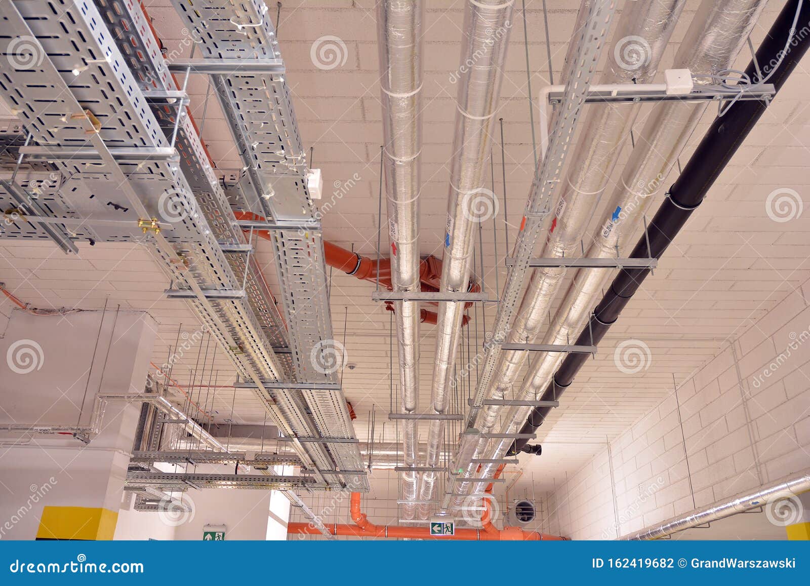 Water Pipes and Cable Trays Run Under Ceiling of a Building Stock Photo ...