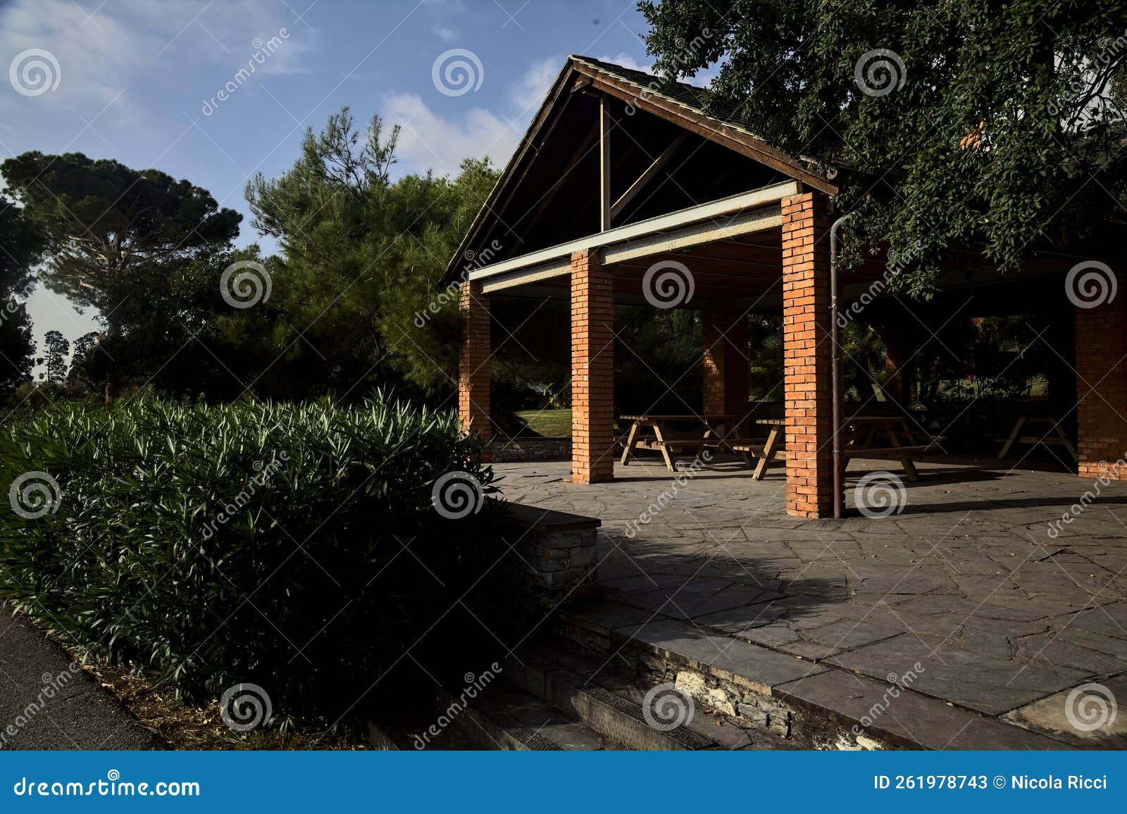 Veranda with Benches and Tables in a Park Stock Image - Image of ...