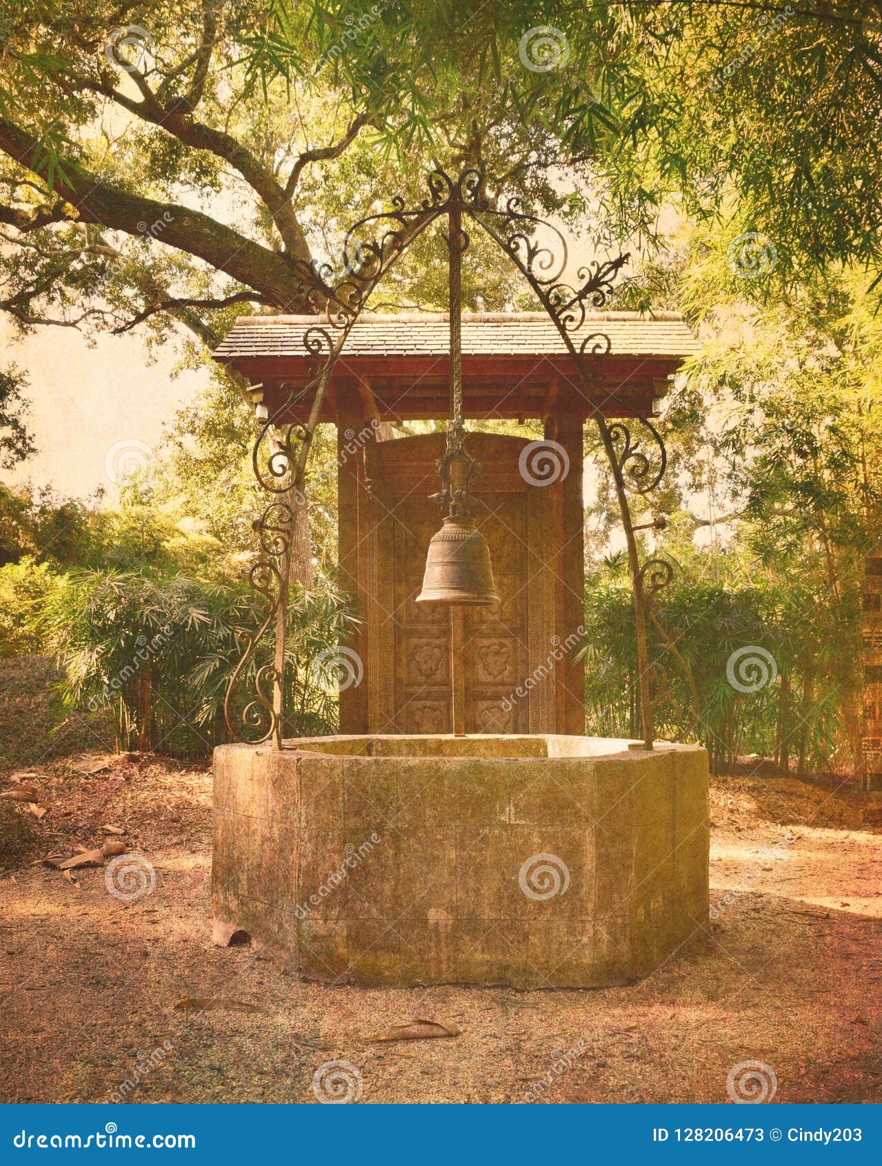 Old Water Well with Ornate Iron Scrollwork & Bell Stock Image - Image ...