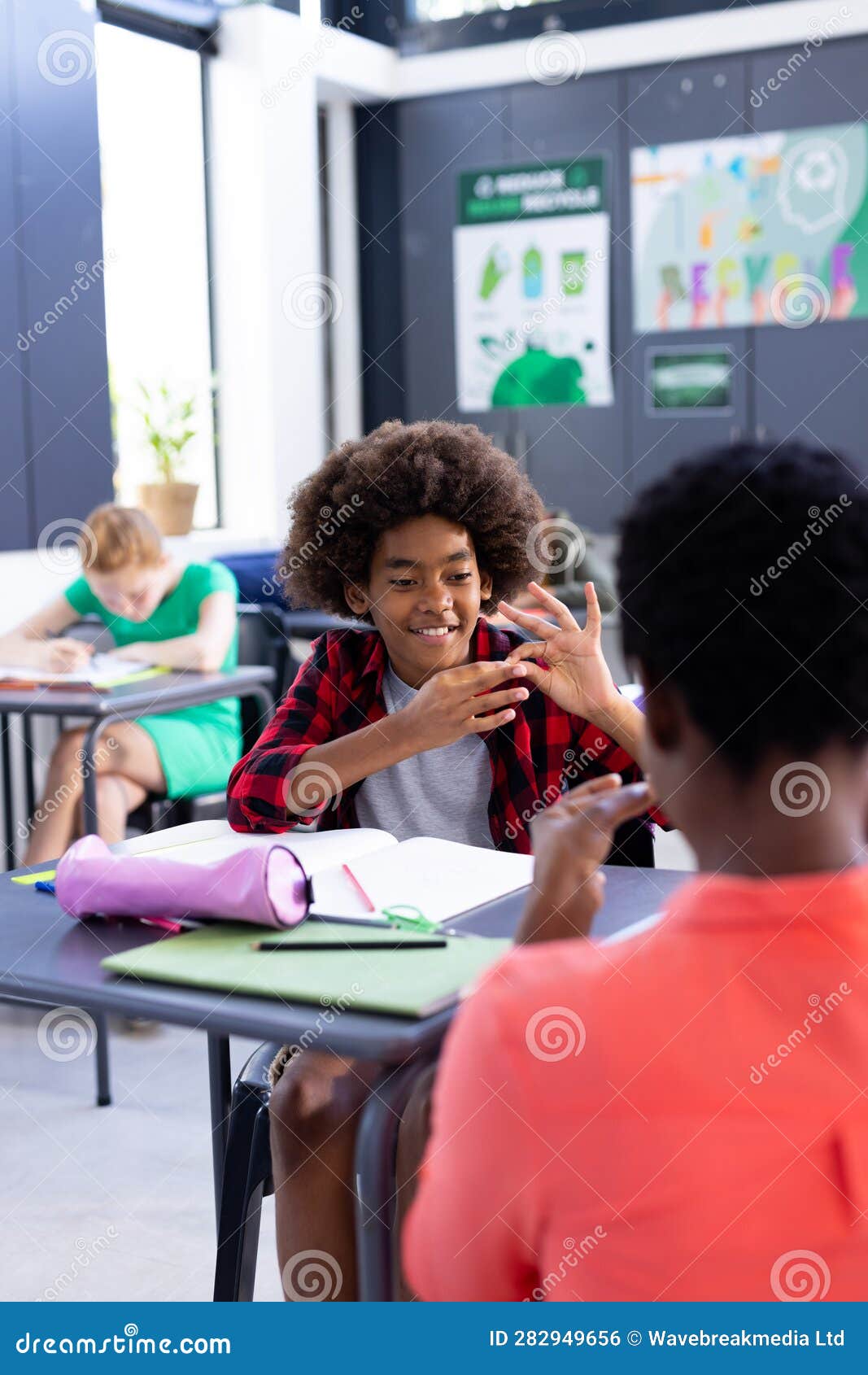 Vertical of African American Female School Teacher and Boy Using Sign ...