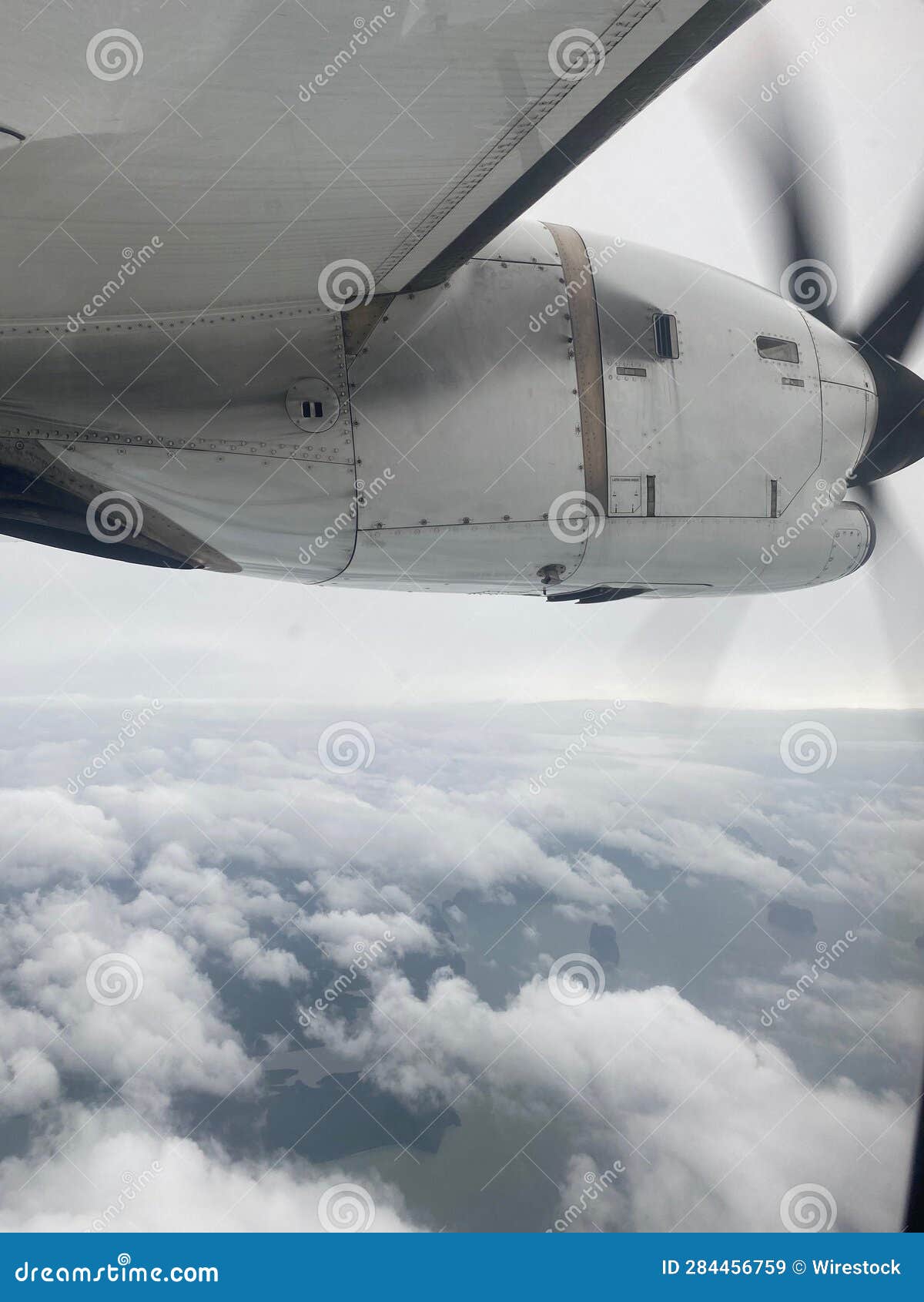 Vertical of an Airplane Flying in the Cloudy Sky Stock Image - Image of ...