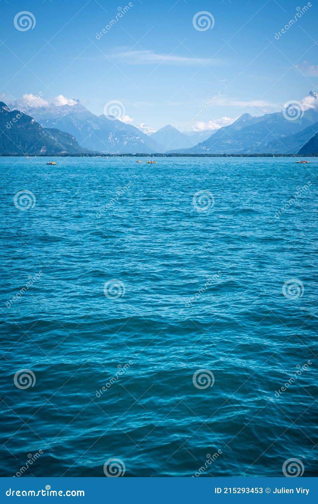 Vertical Backdrop of Calm Lake Water and Clear Blue Summer Sky with ...