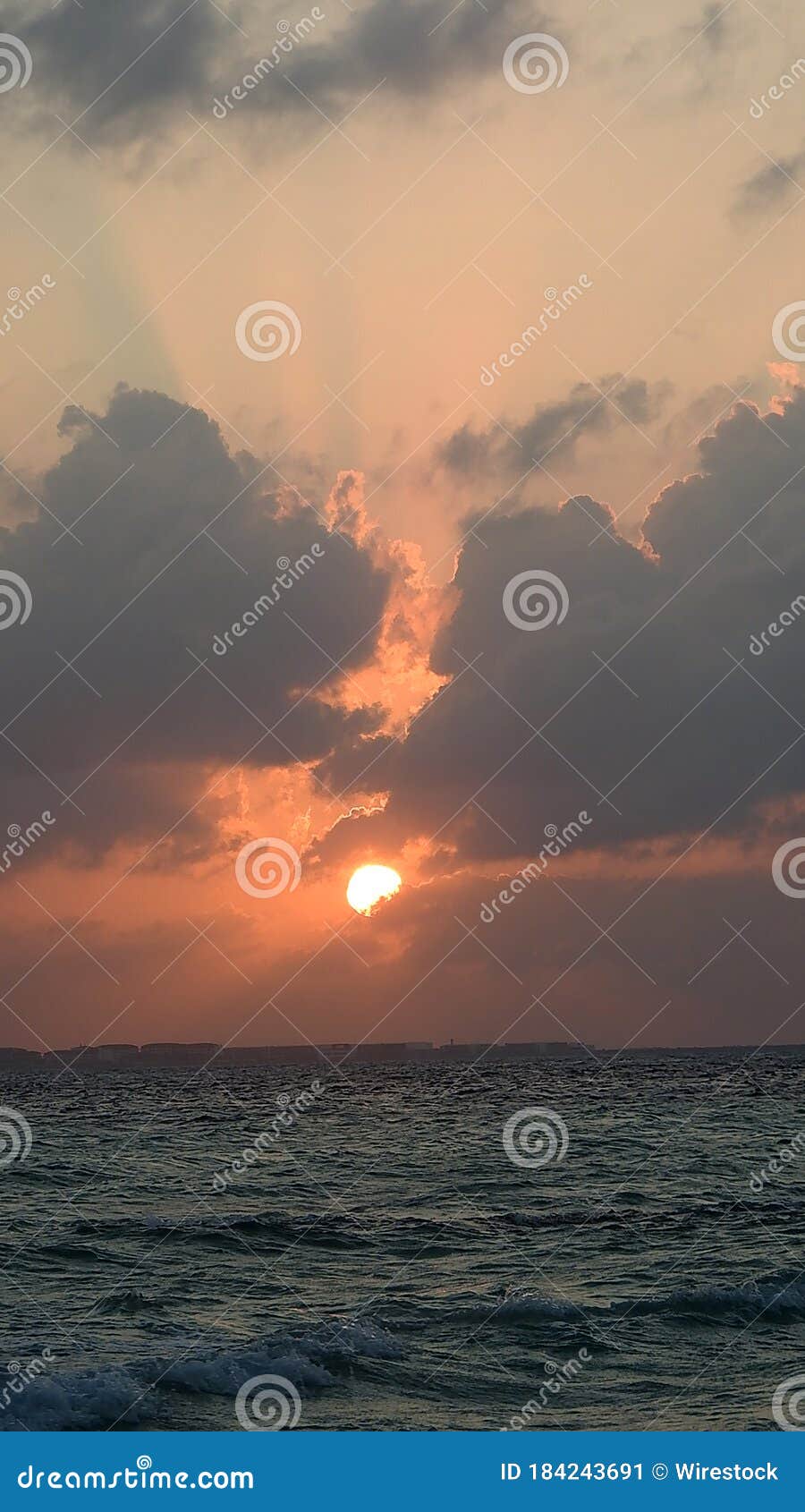 Vertical of a Beautiful Sunset with a Round Sun Stock Image - Image of ...