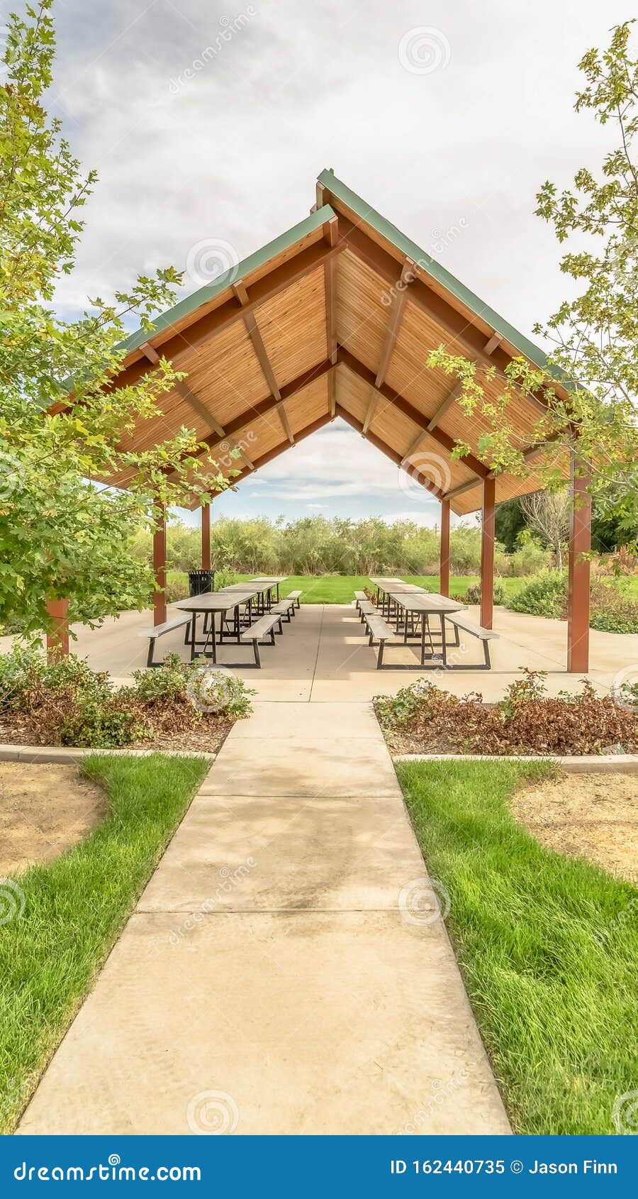 Vertical Beautiful View of a Picnic Pavilion at a Park with Pathway and ...