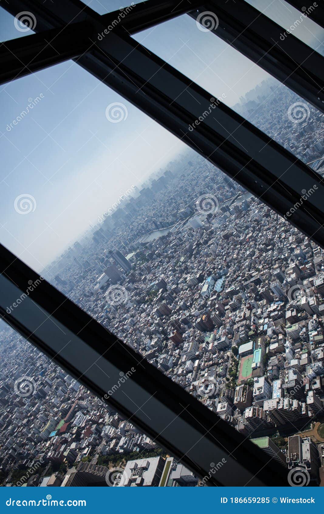 Vertical Birds-eye View of a City from the Skyscraper Glass Window ...