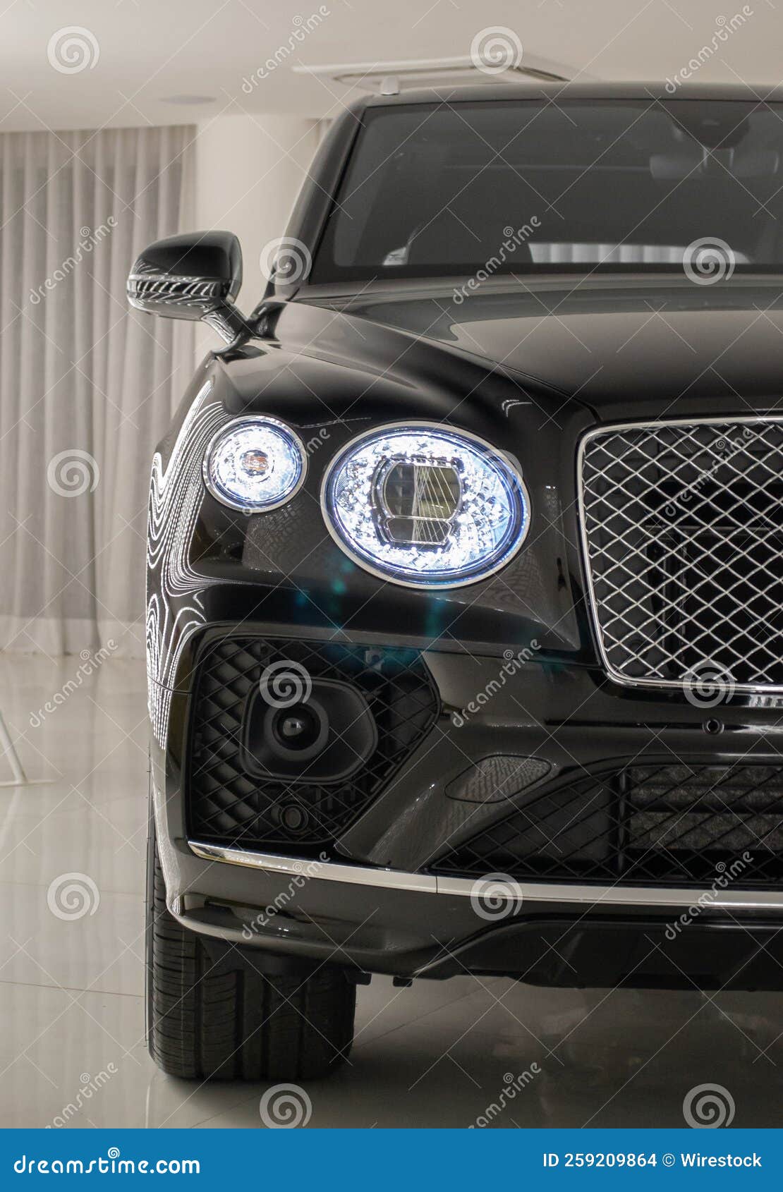 Vertical of Black Bentley Bentayga Front View with Headlights on ...