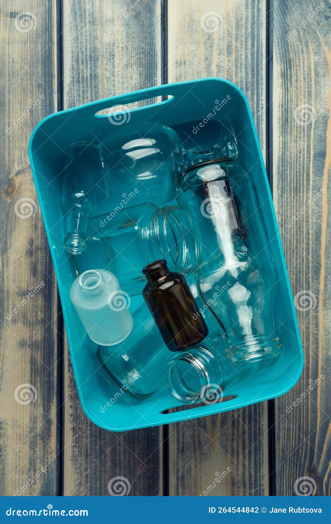 Vertical Blue Plastic Container Full of Transparent Plastic and Glass ...