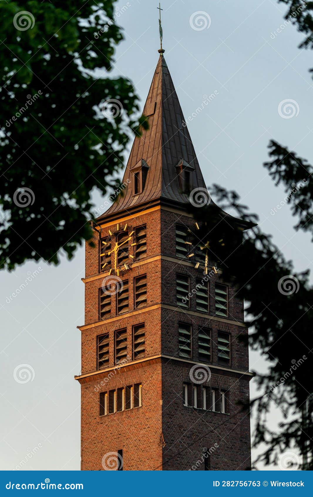 Vertical of a Brick Clock Tower at Golden Hour Stock Image - Image of ...