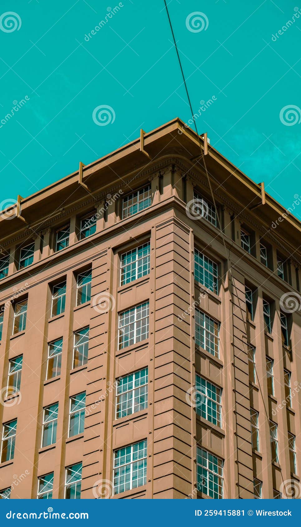 Vertical of a Building Corner with Windows Under a Blue Sky. Stock ...