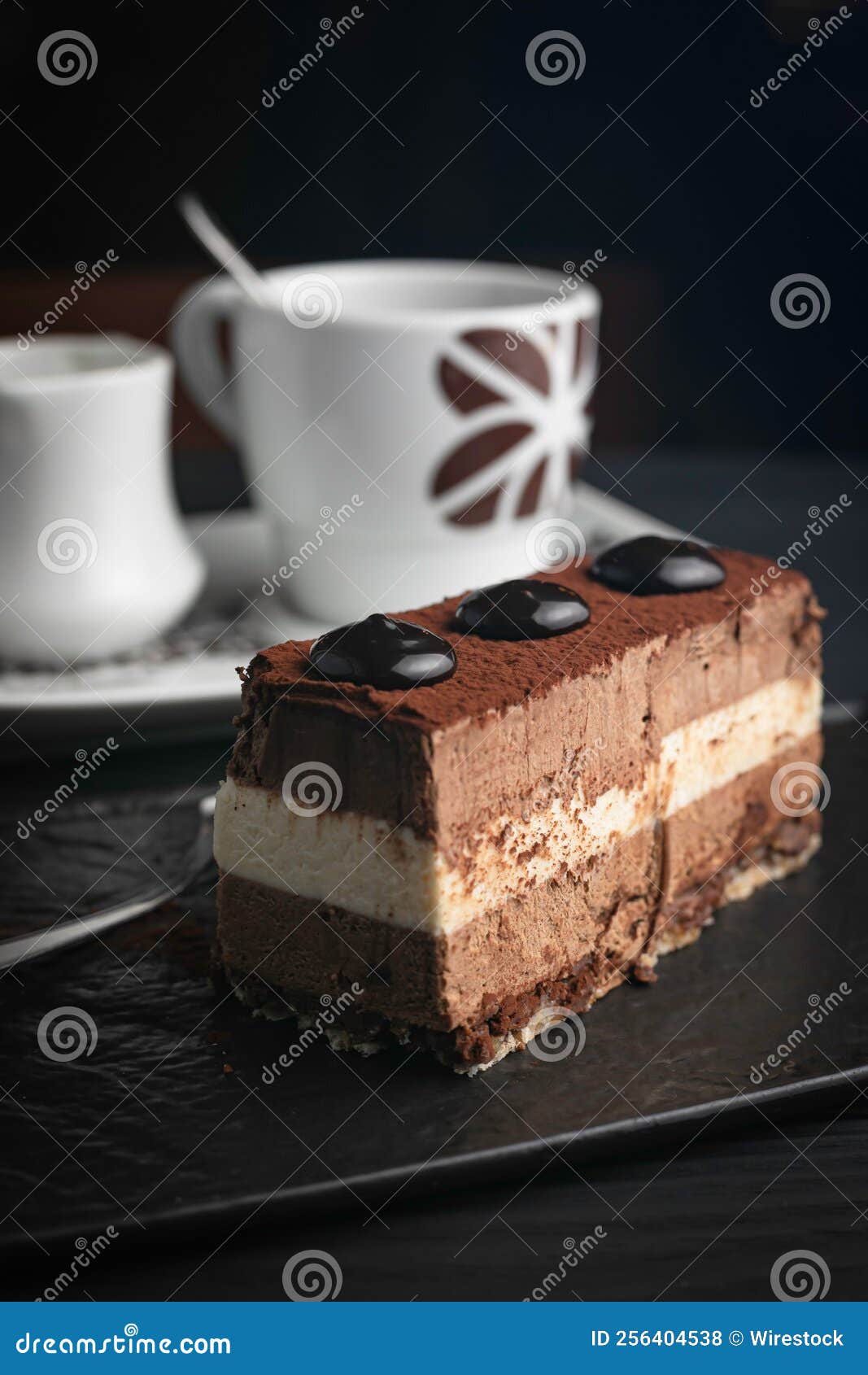 Vertical of a Chocolate Slice Cake Served on a Plate with a Cup of ...
