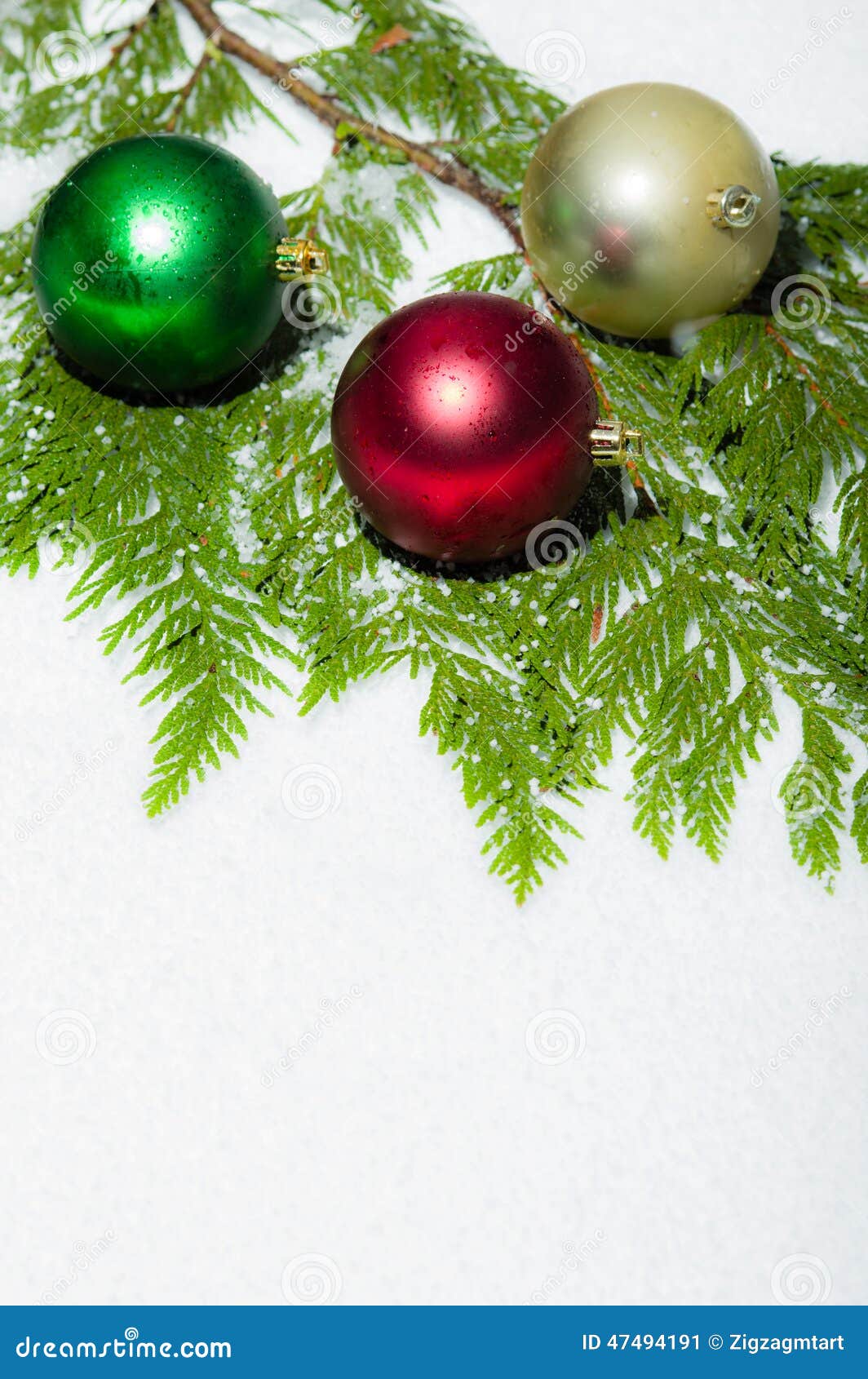 Vertical of Christmas Balls on Snow Stock Image - Image of evergreens ...