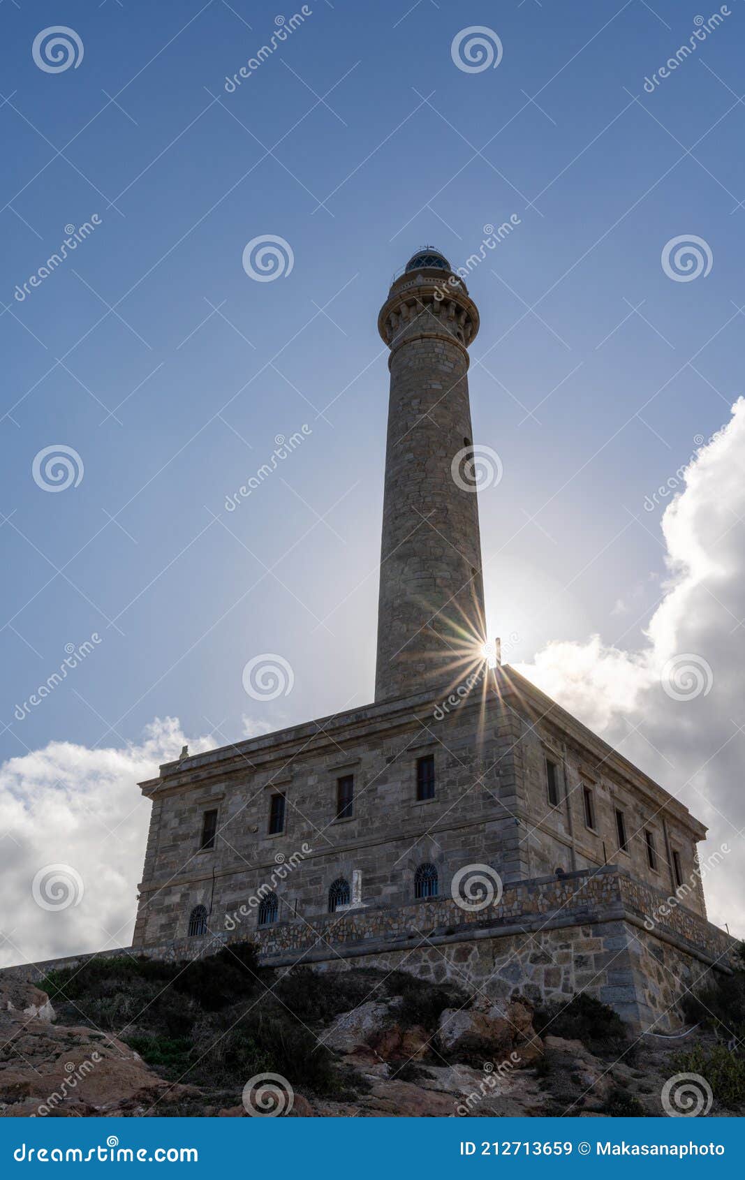 Vertical Close Up View of the Cape Palos Lighthouse in Spain with a Sun ...