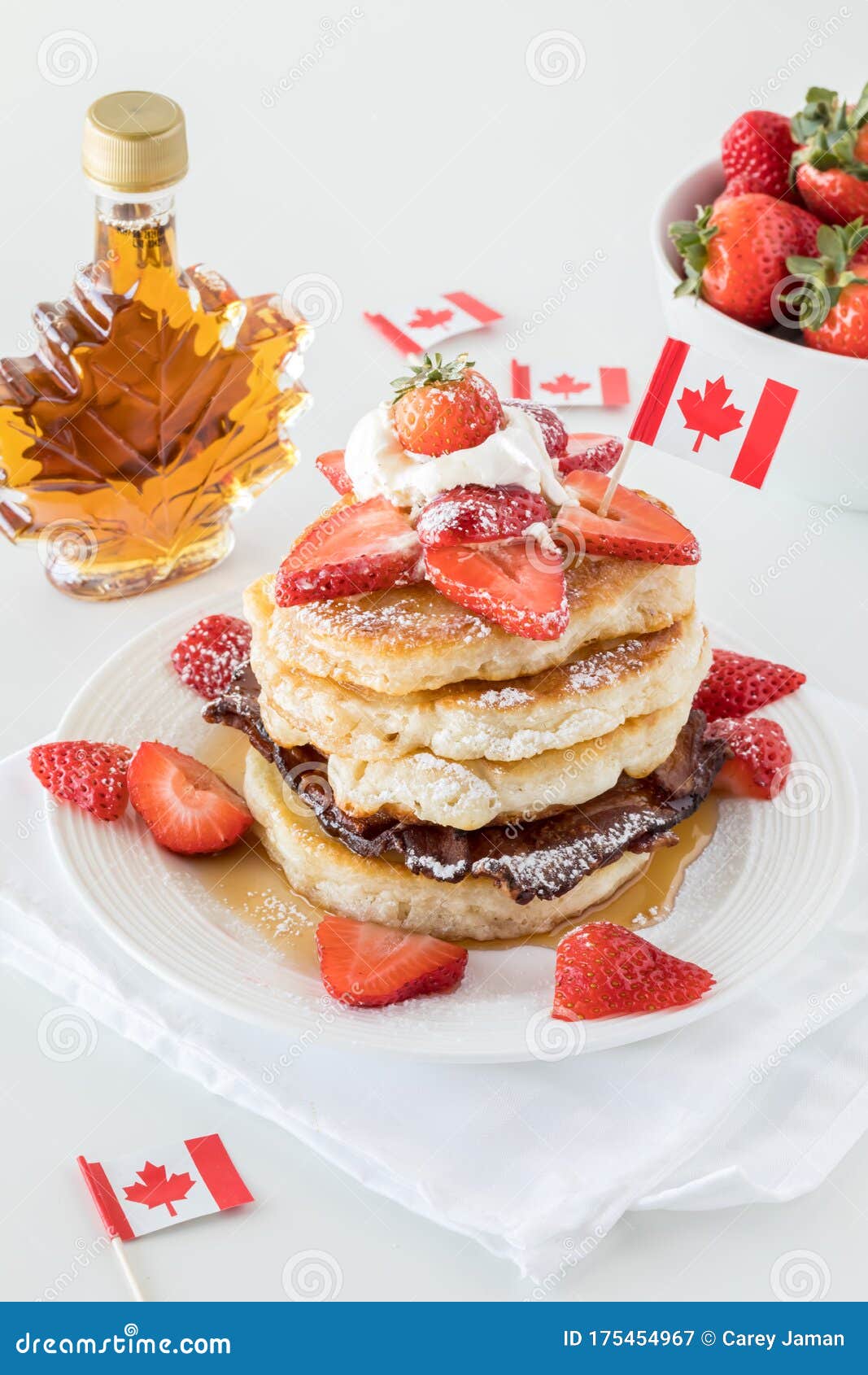 A Vertical Close Up View of a Plate of Pancakes with Strawberries with ...