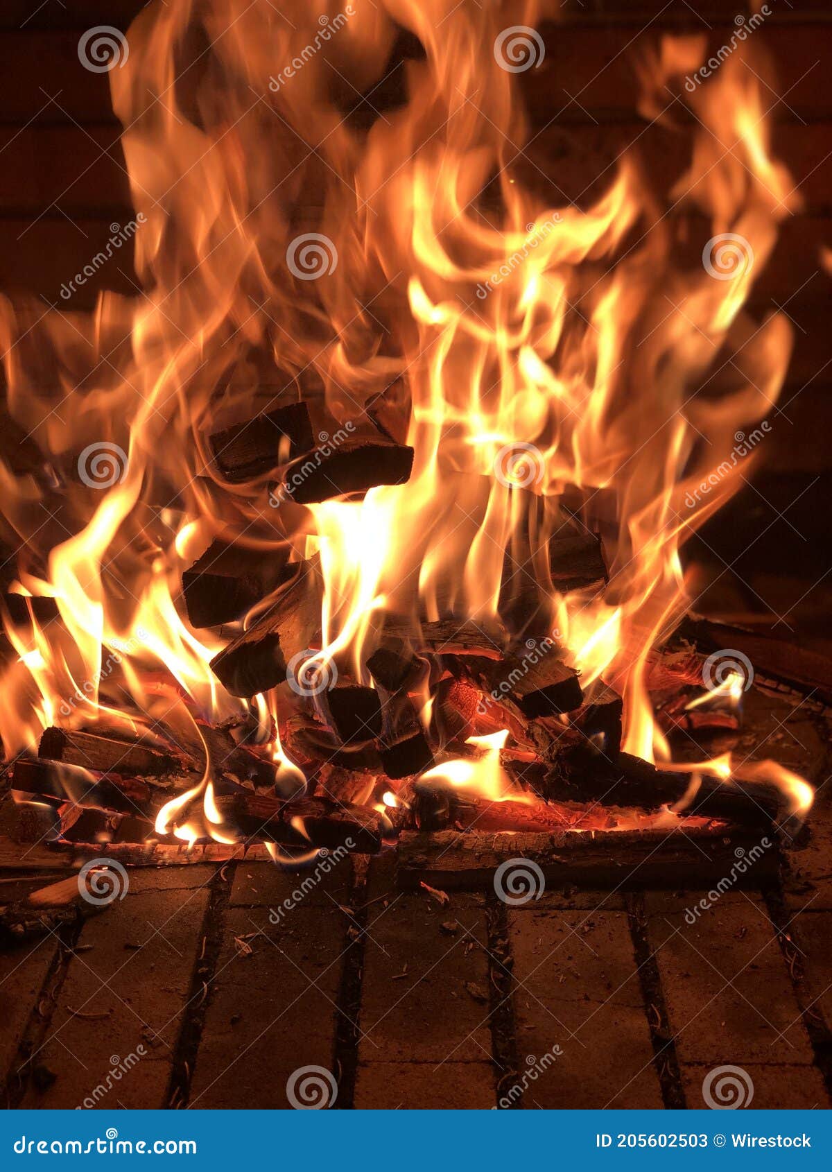 Vertical Closeup of a Bright Campfire on a Brick Surface Stock Image ...