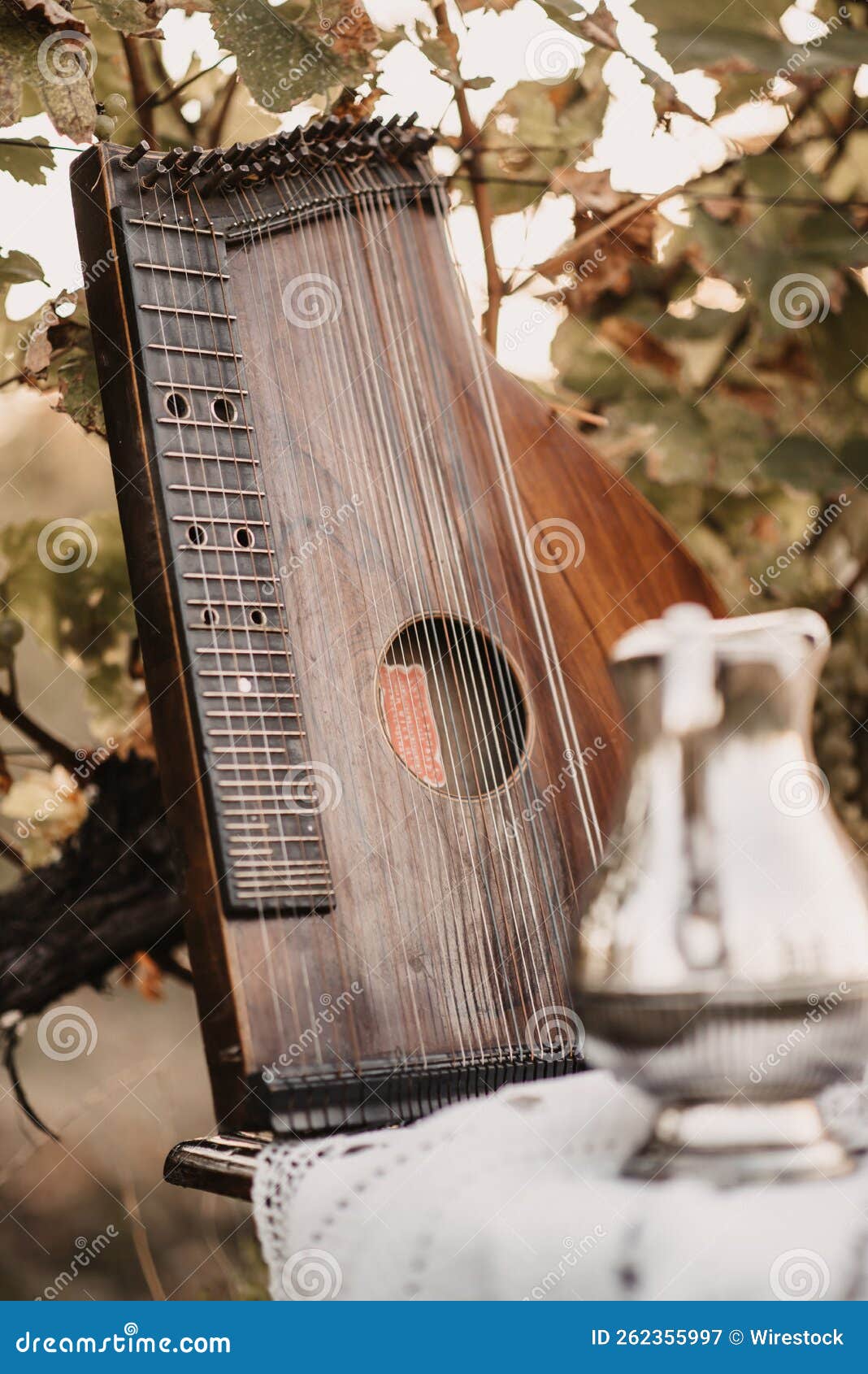 Vertical Closeup of a Brown Zither on the Table Outdoors. Stock Image ...