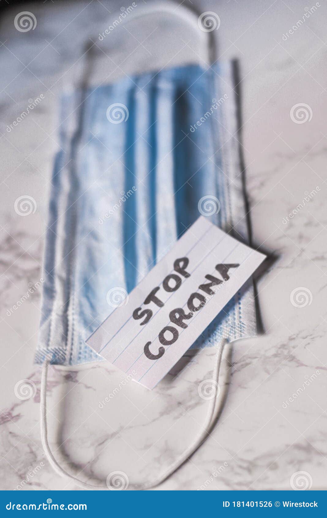 Vertical Closeup of a Face Mask with a [stop Corona] Sign on it on the ...
